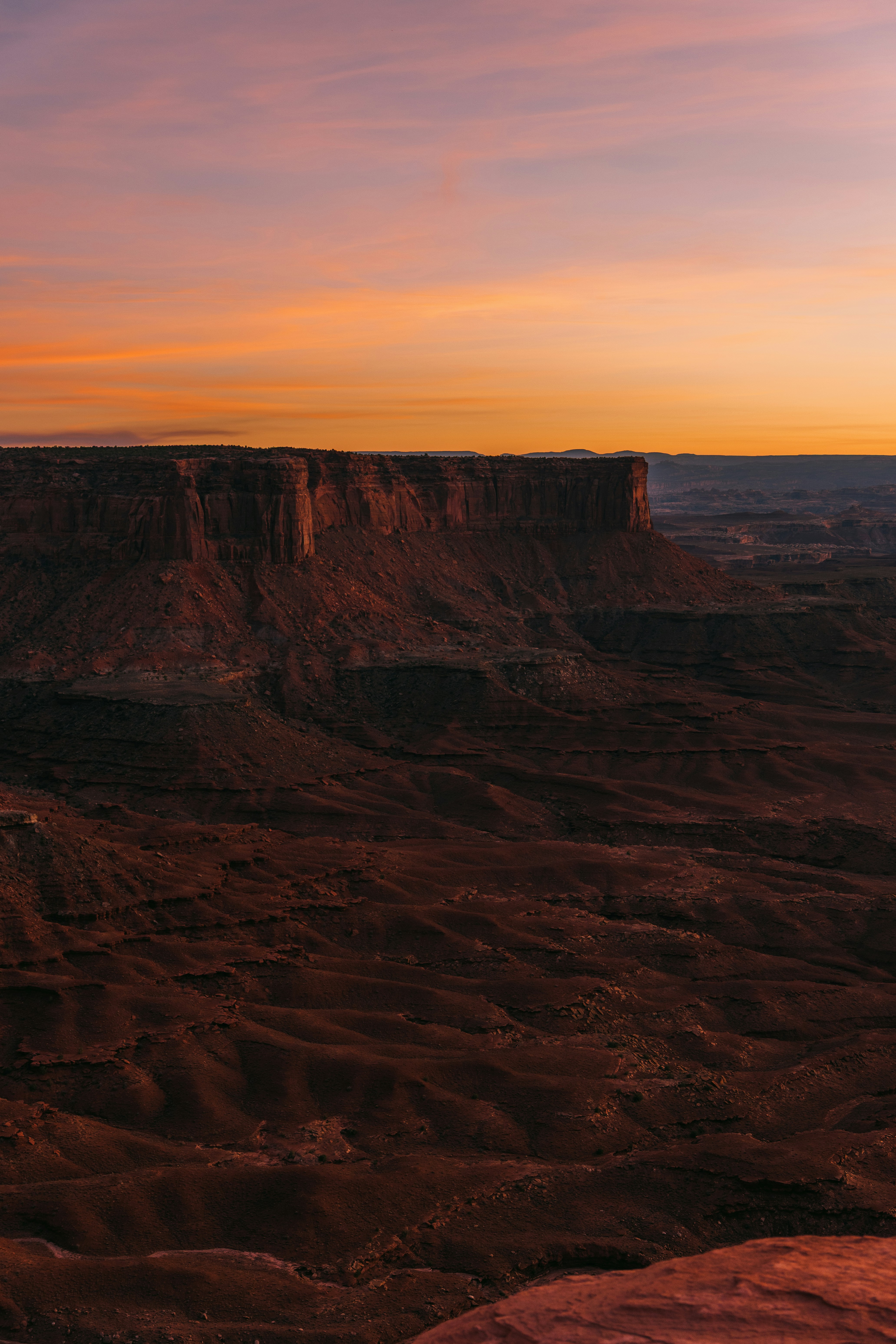 Sunset Over Red Cliffs: A Quiet Descent into Shadowed Canyon