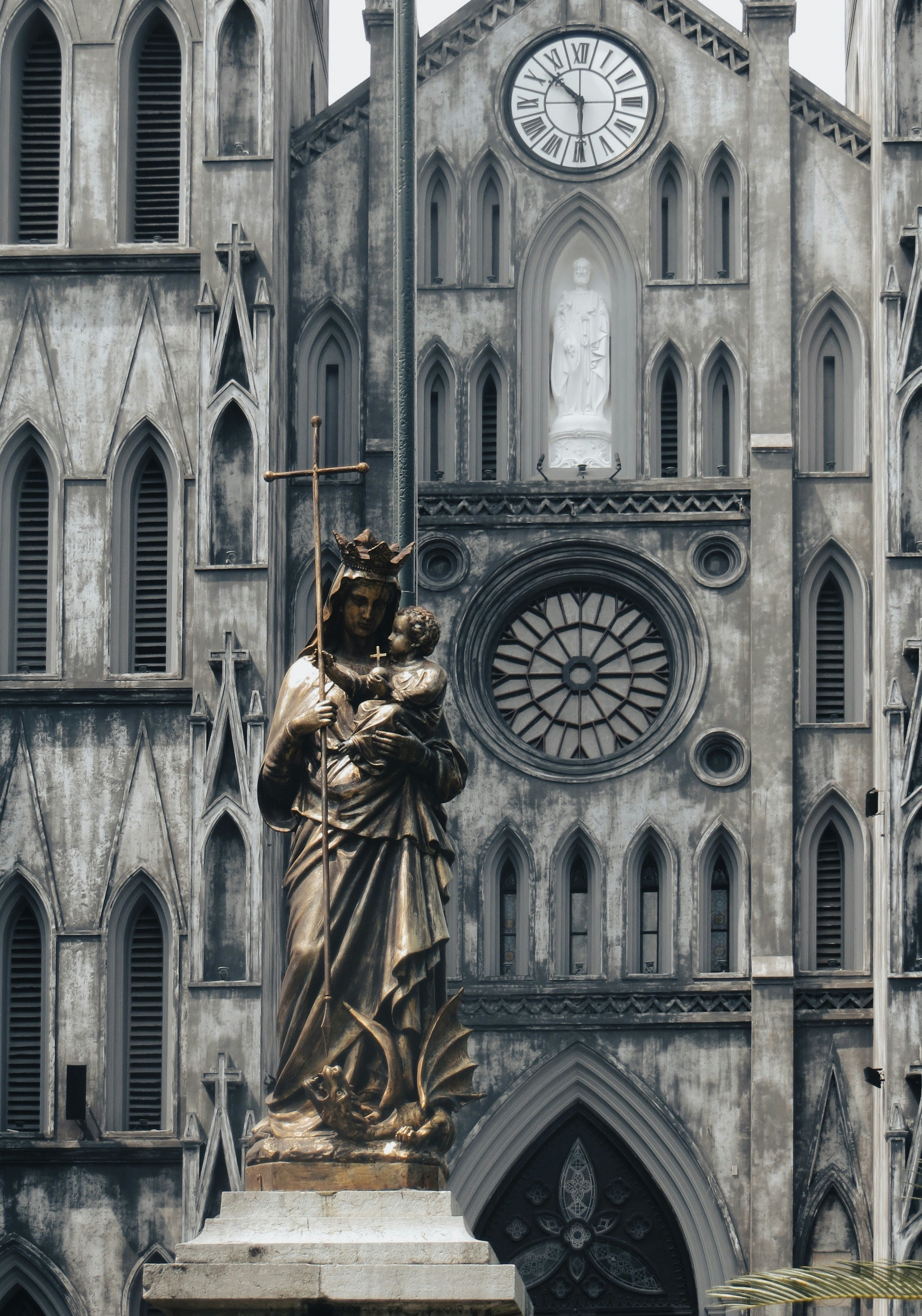 Statue in front of a gothic cathedral