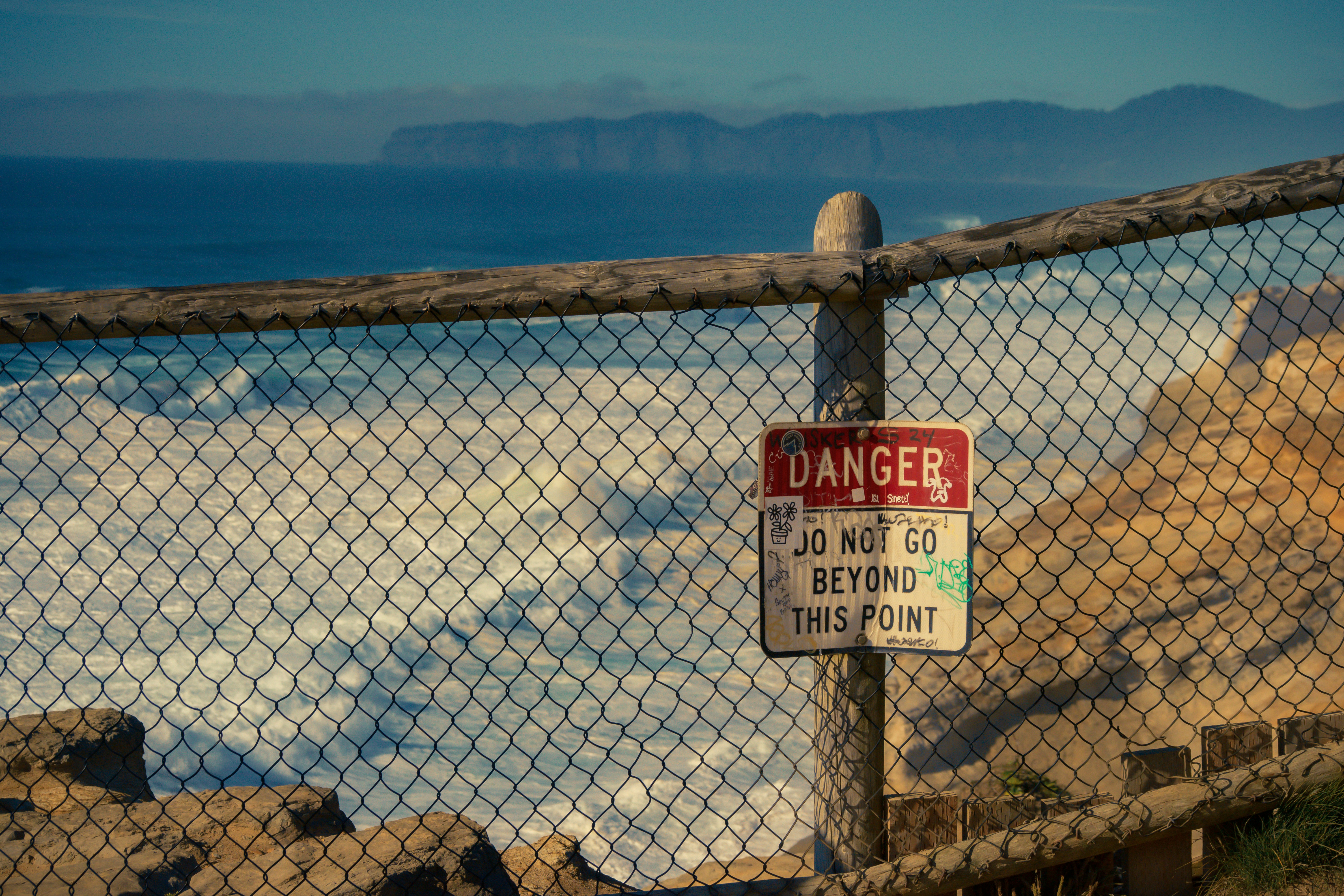 Fence of Warning Overlooking the Ocean Cliffs