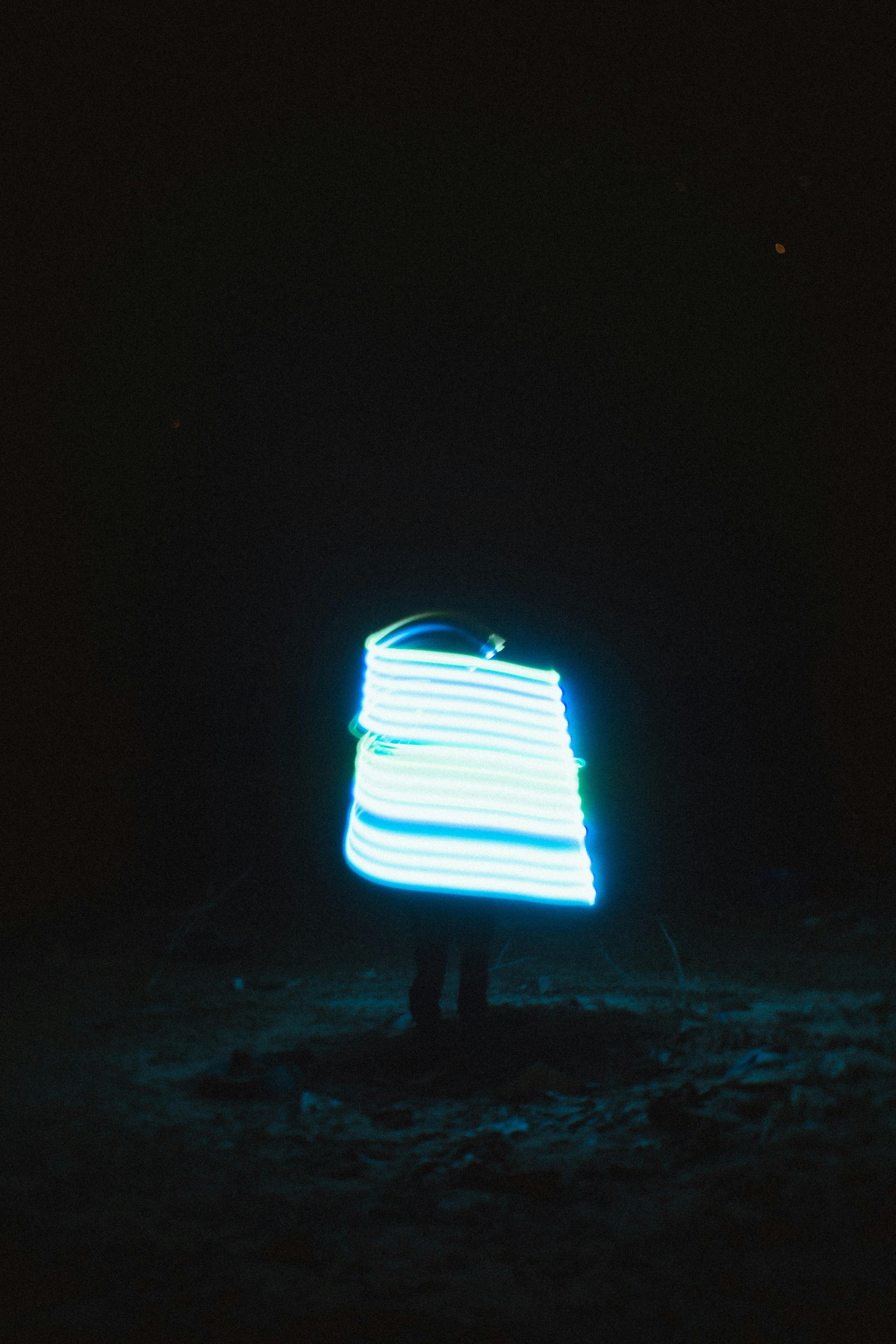 Neon Ribbon Night: Light-Painted Silhouettes in a Snowy Clearing