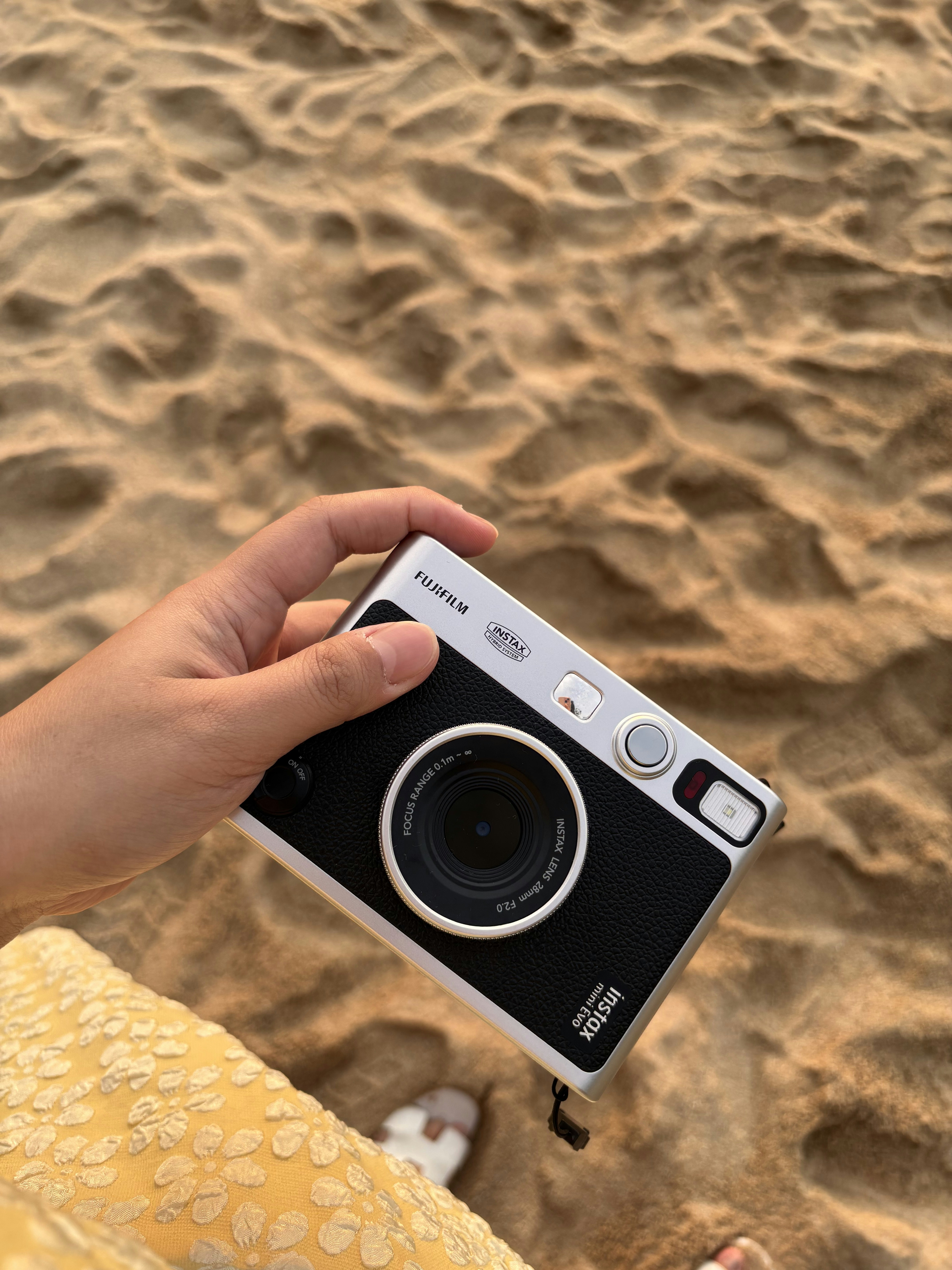 Dune Portrait: A Hand-Held Fujifilm on Sunlit Sand