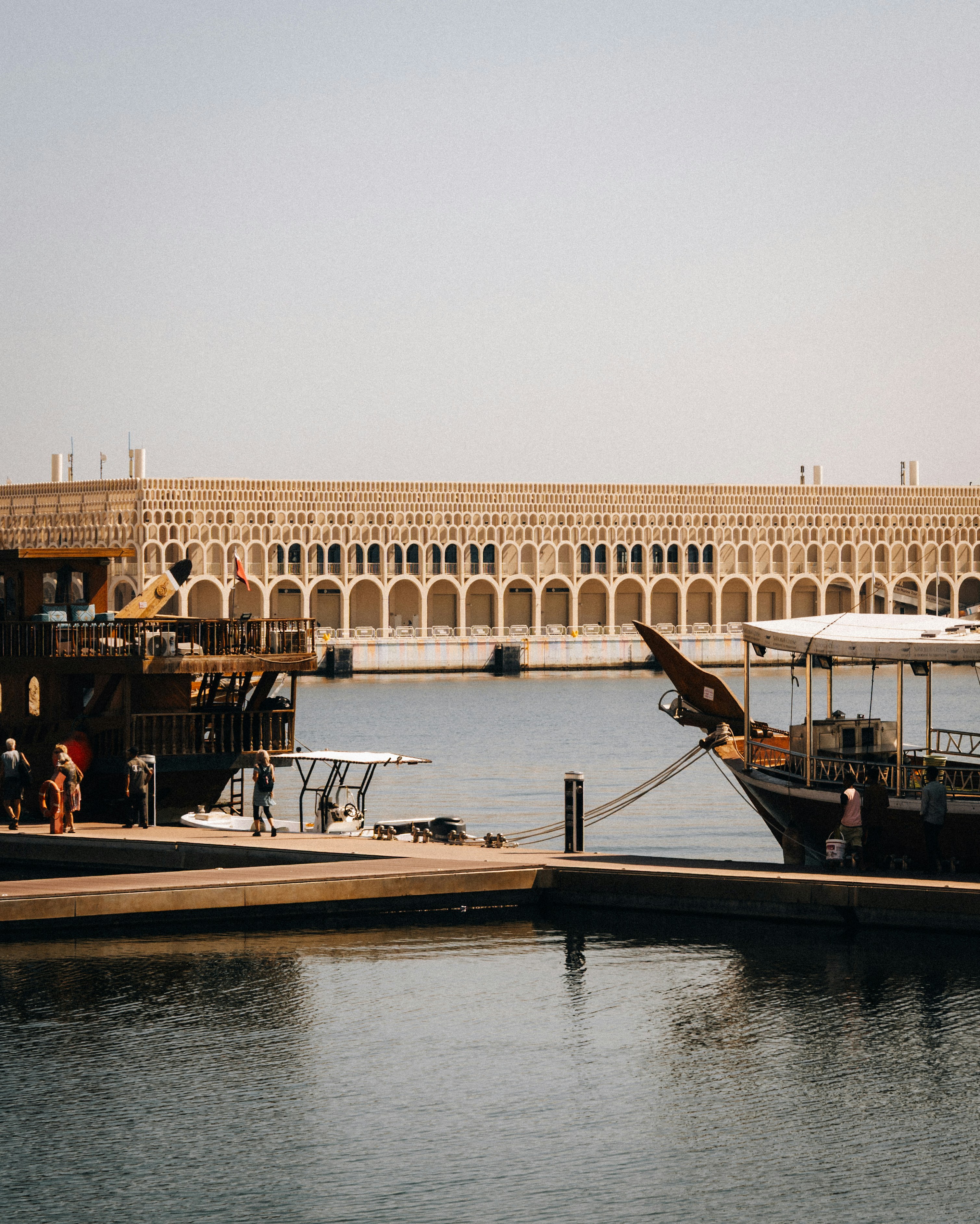 Golden arches reflecting across calm water