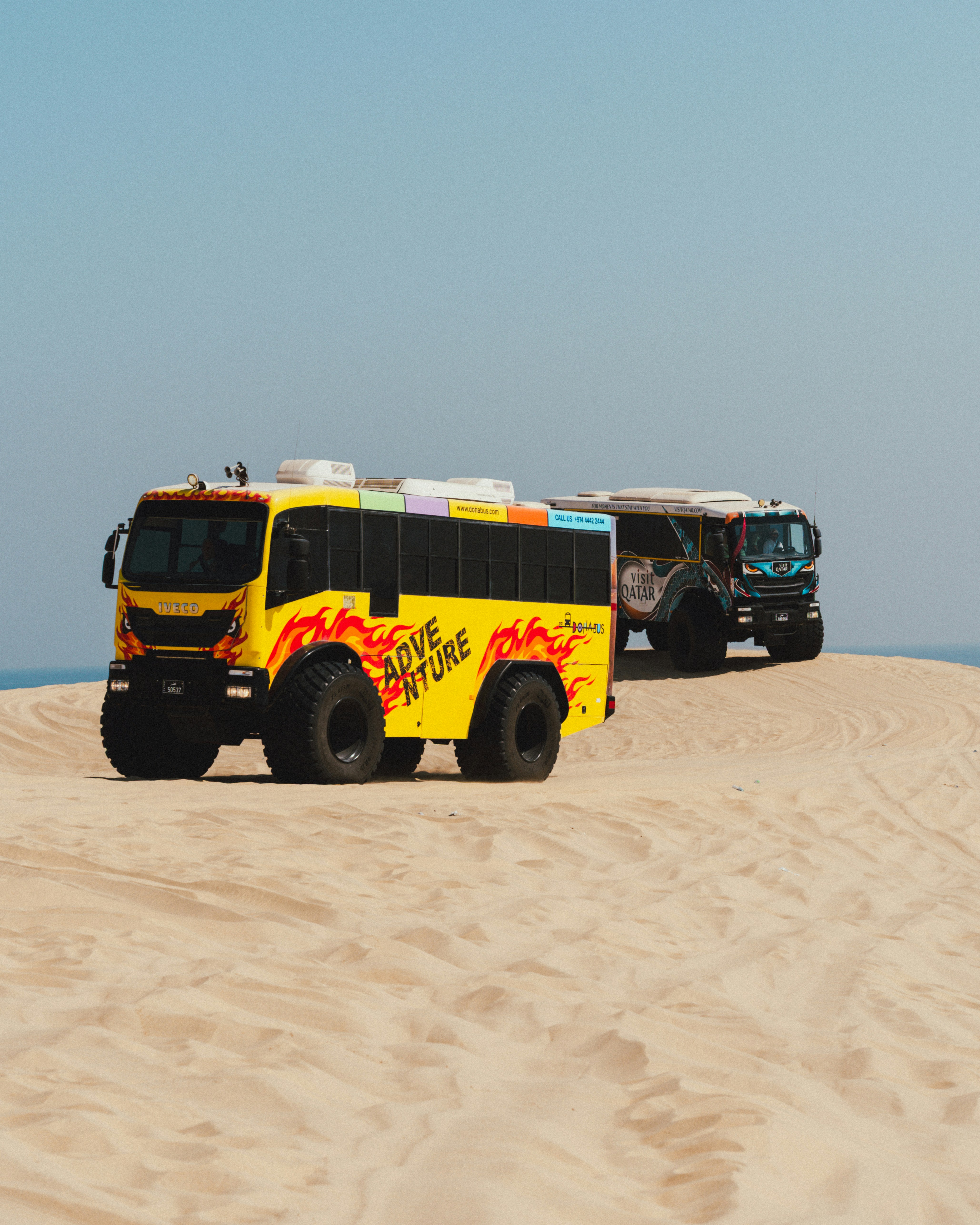 Two off-road buses driving on sand dunes photo – Free Travel Image on ...