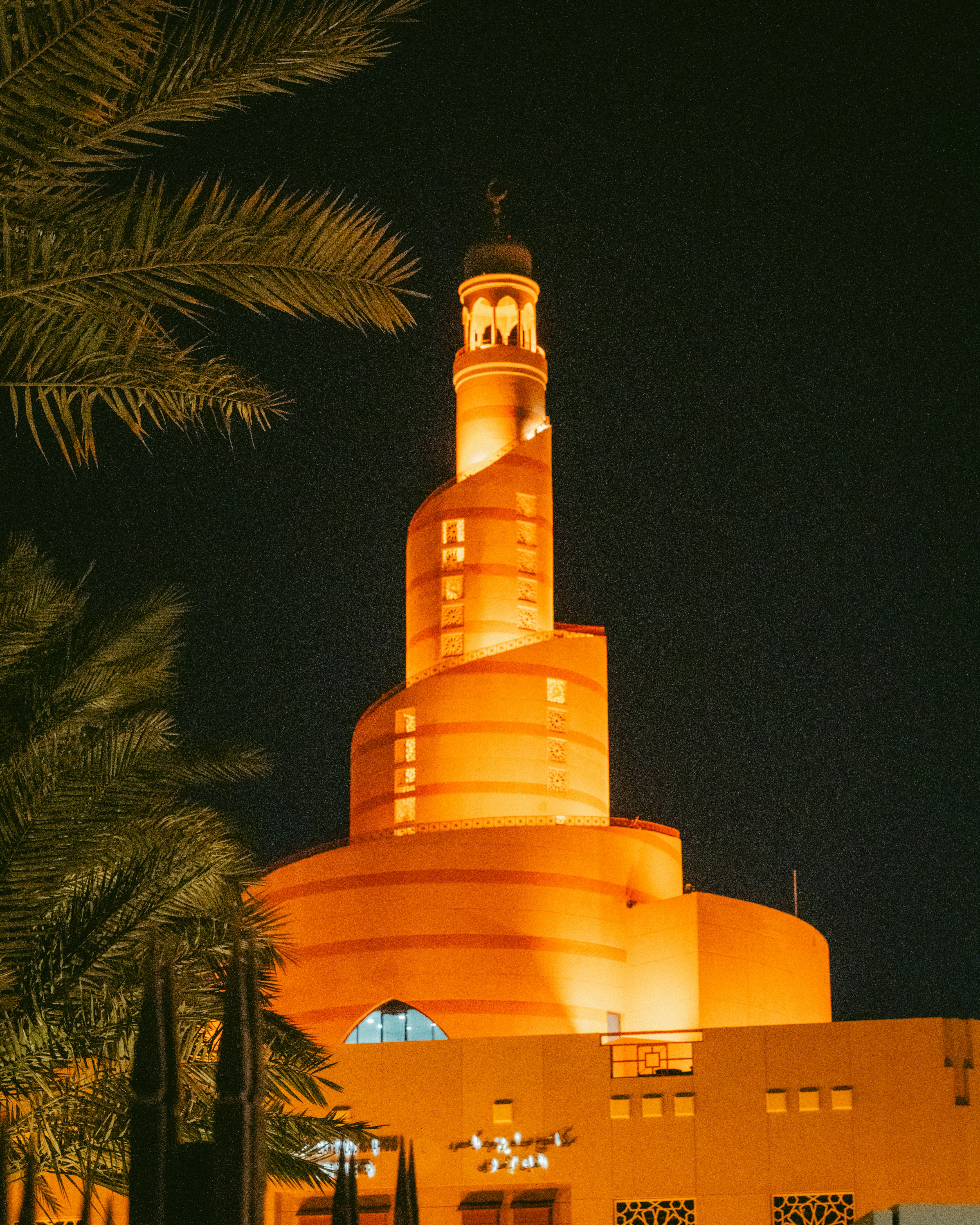 Spiral Ember Over Palm Fronds: Night-Glow Tower