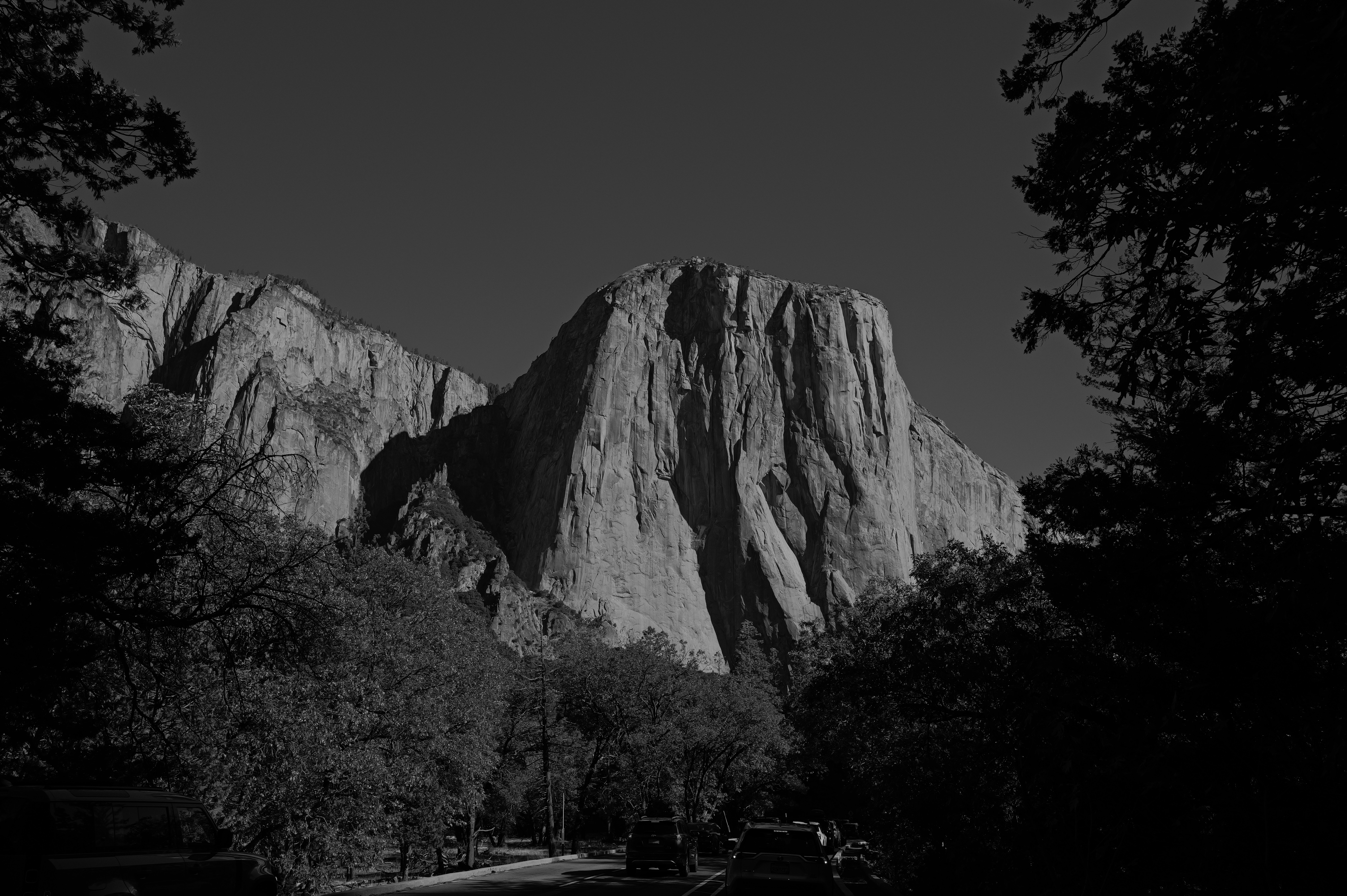 Granite Sentinel Over a Quiet Forest Road