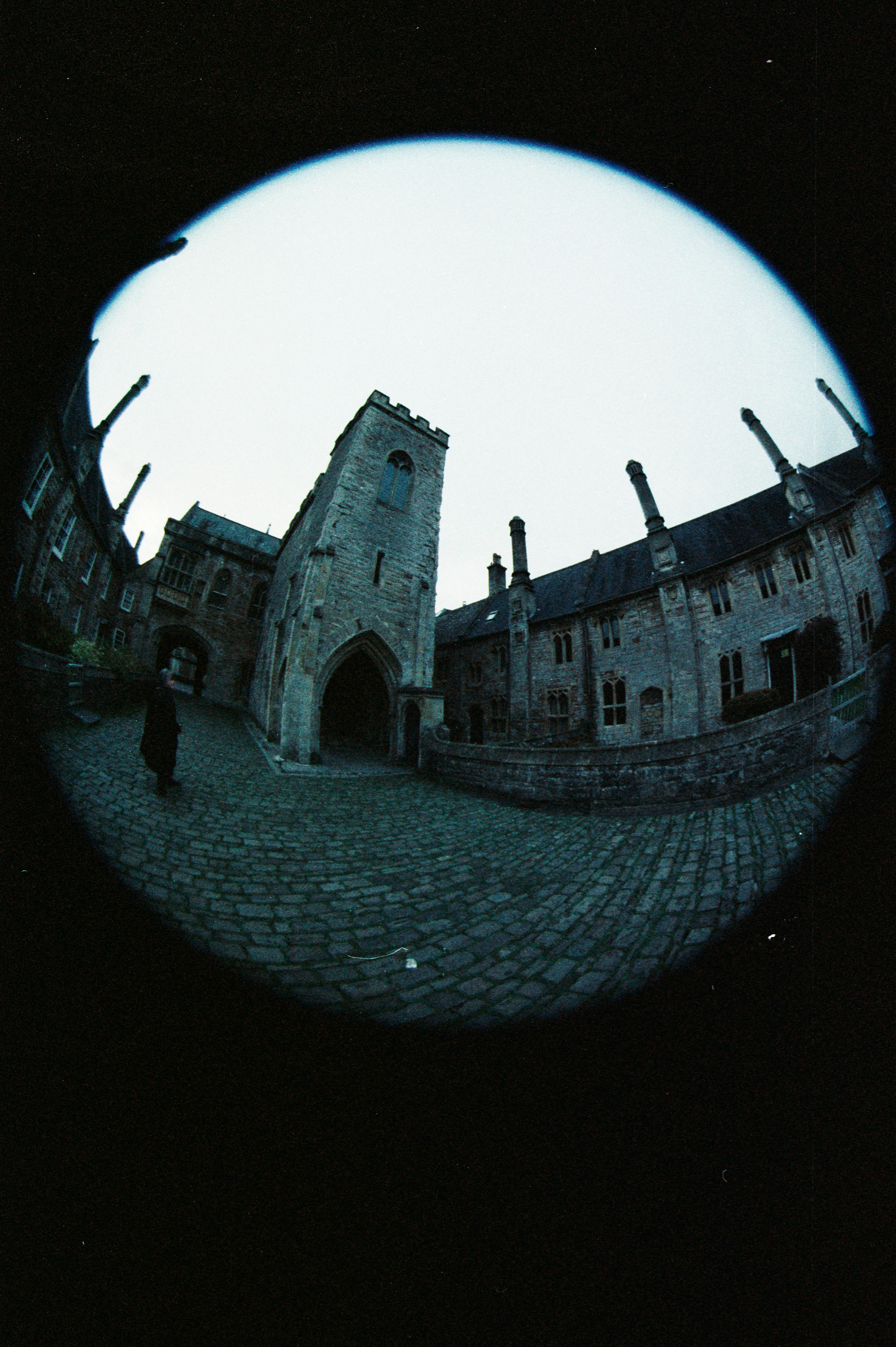 Fisheye Cloister: A Medieval Courtyard Wrapped in Night
