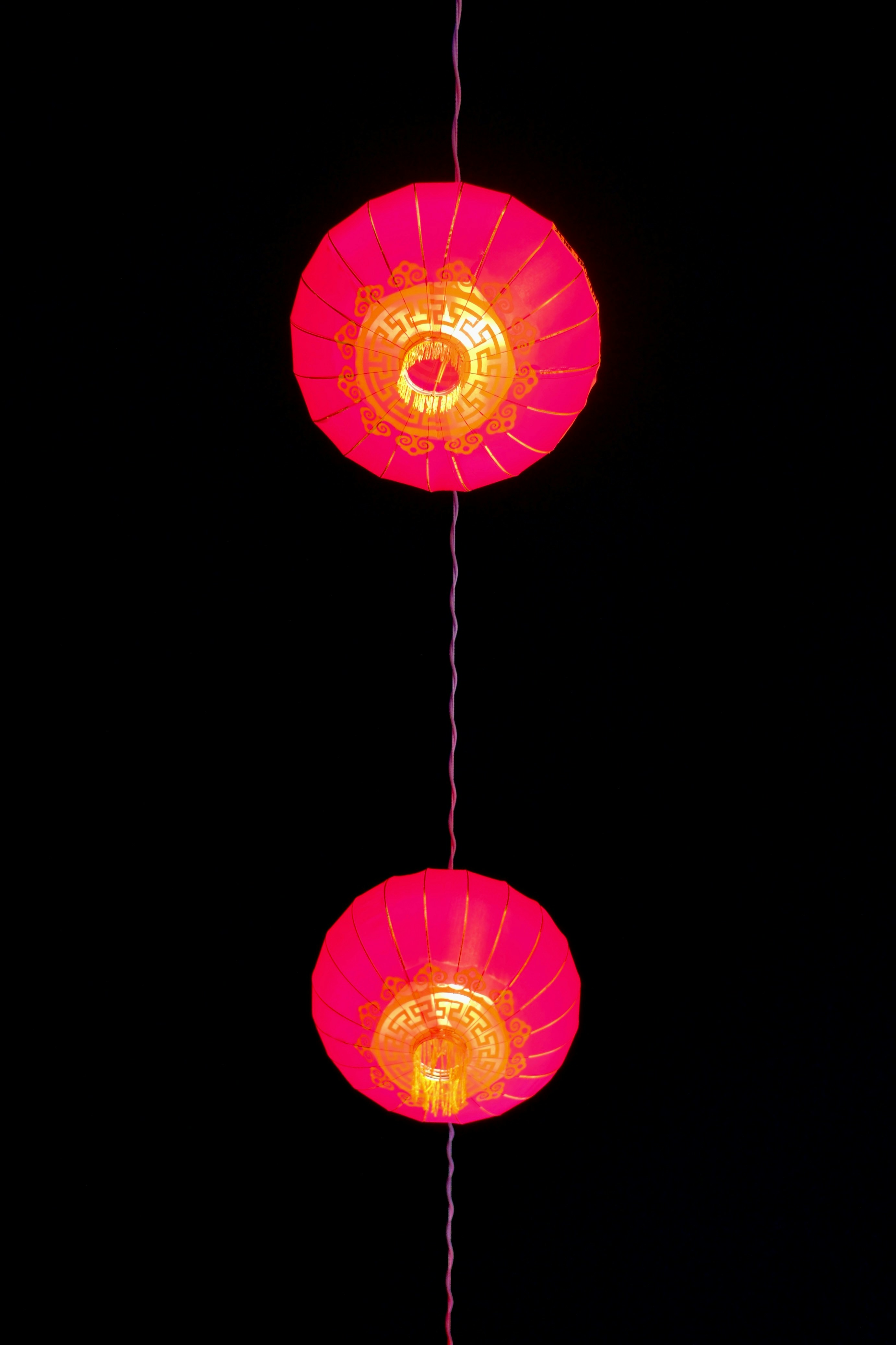 Twin Red Lanterns Drifting Along a Velvet Night