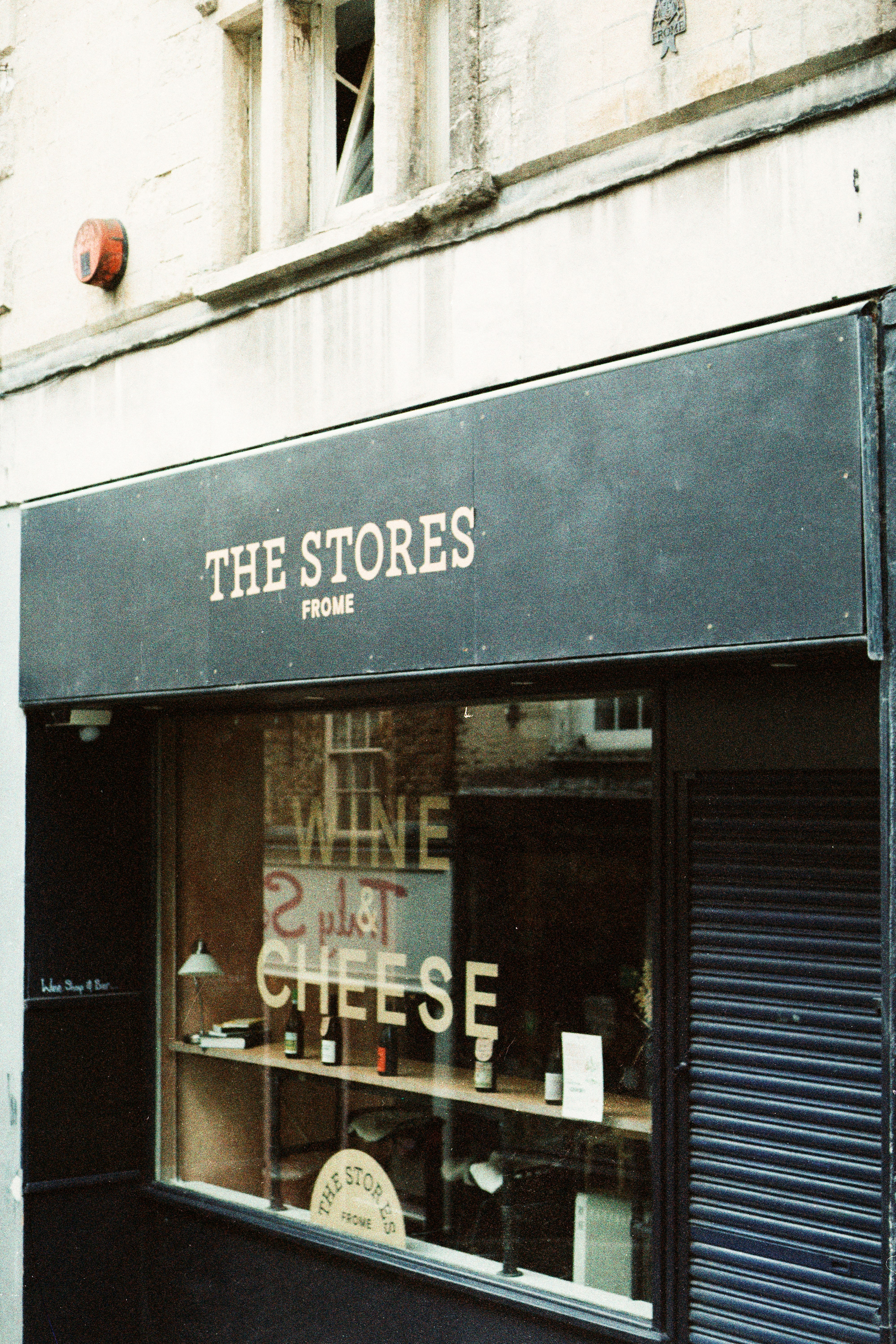 Frome Storefront Window: Cheese and Wine in Quiet Display