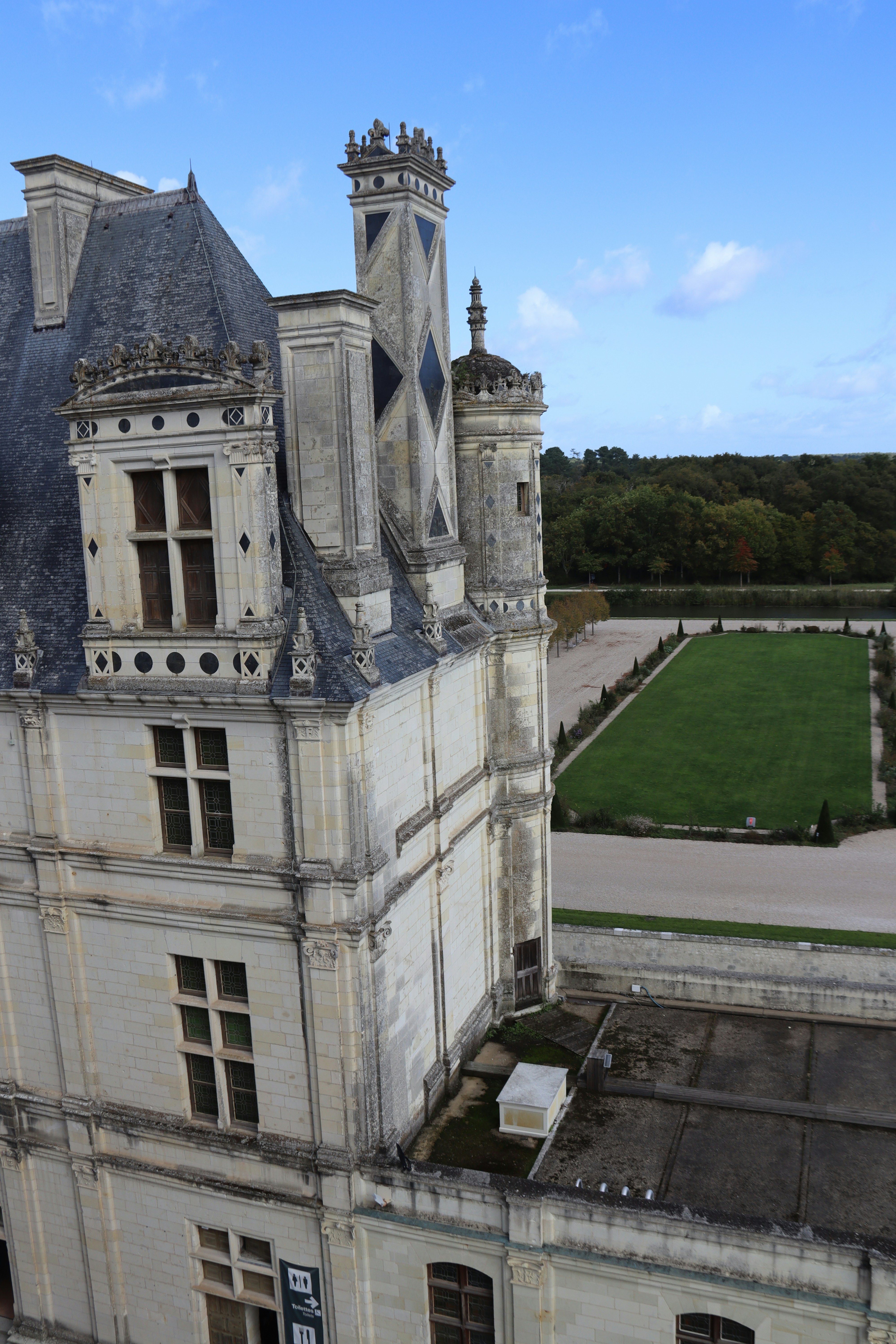Diamond-Spired Turret Over a French Château and Parterre
