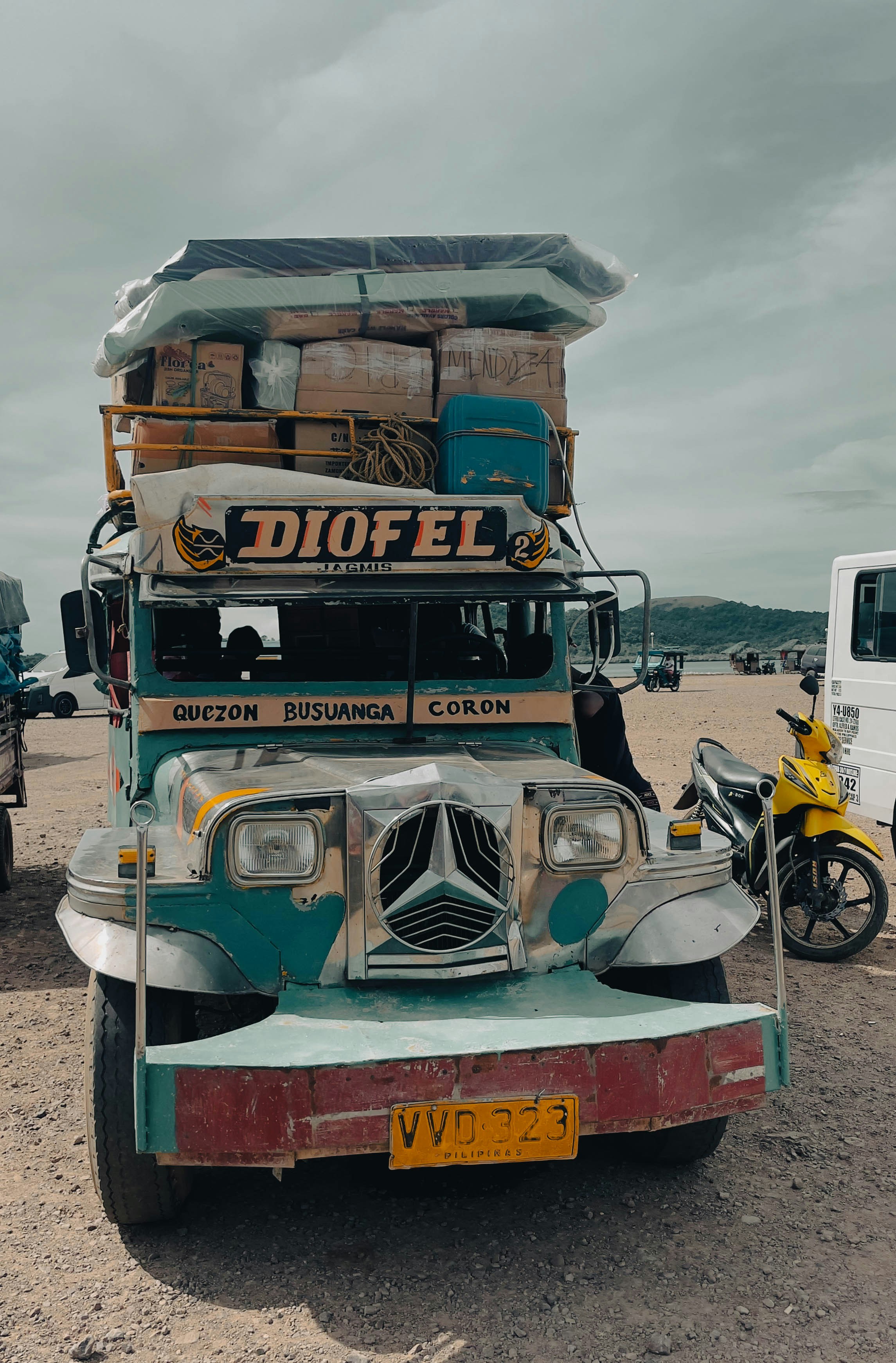 Cargo-Laden Jeepney Anchored on a Beachfront Under a Cloudy Sky
