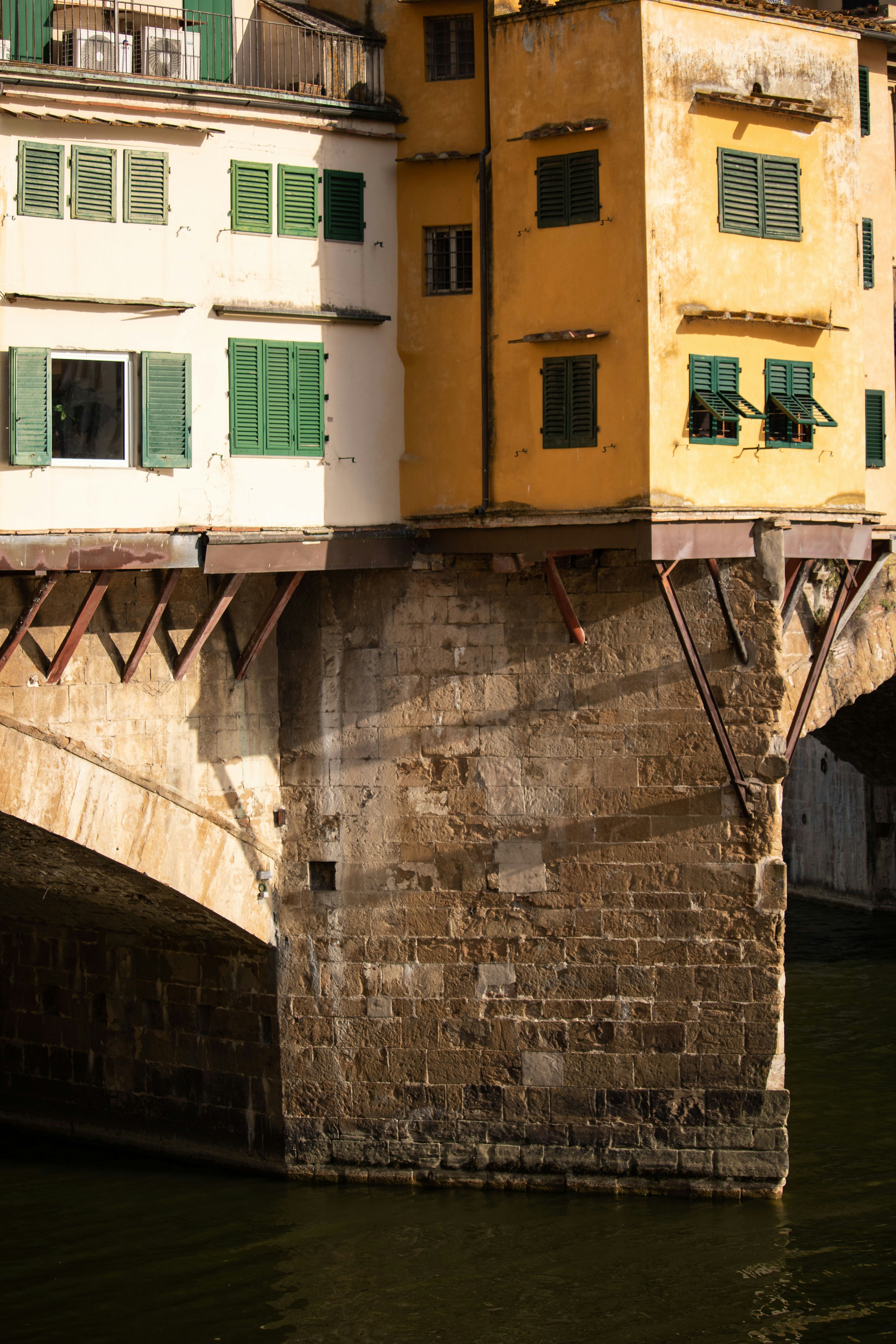 Colorful buildings on a stone bridge over water photo – Free ...
