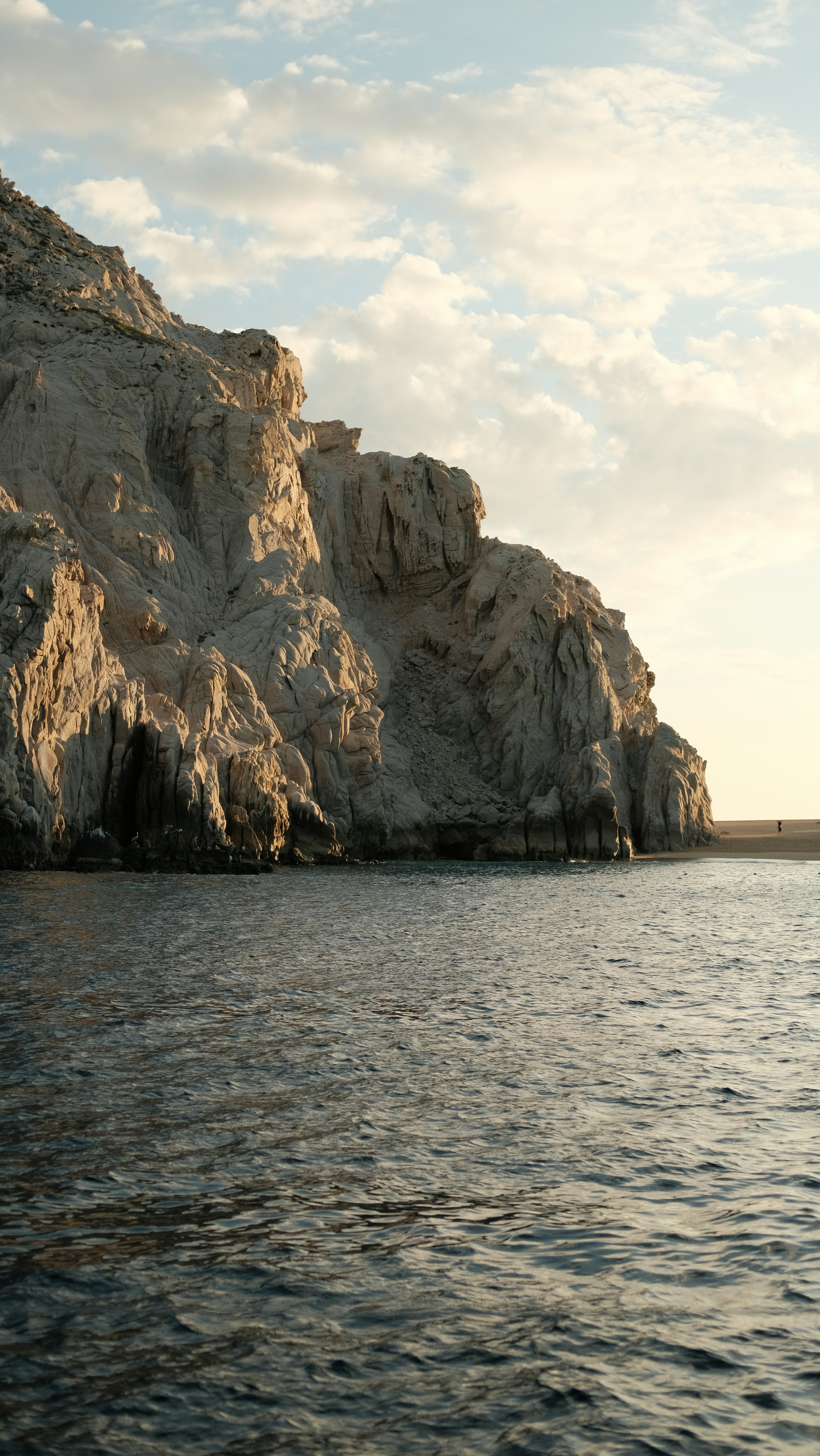 Edge of Light: Golden Cliffs Framing a Quiet Sea