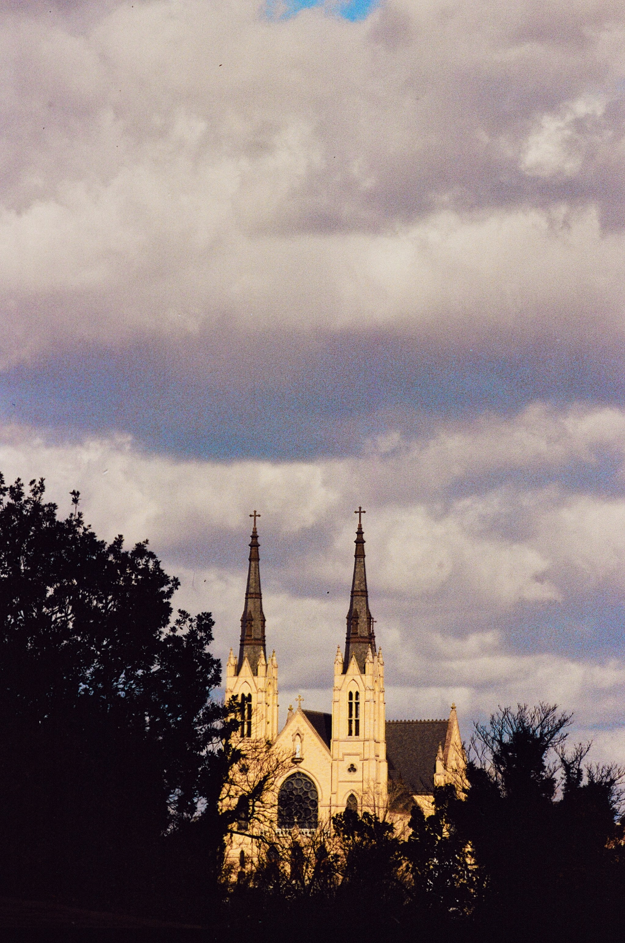 A grand church with two spires against cloudy sky photo – Free Building ...