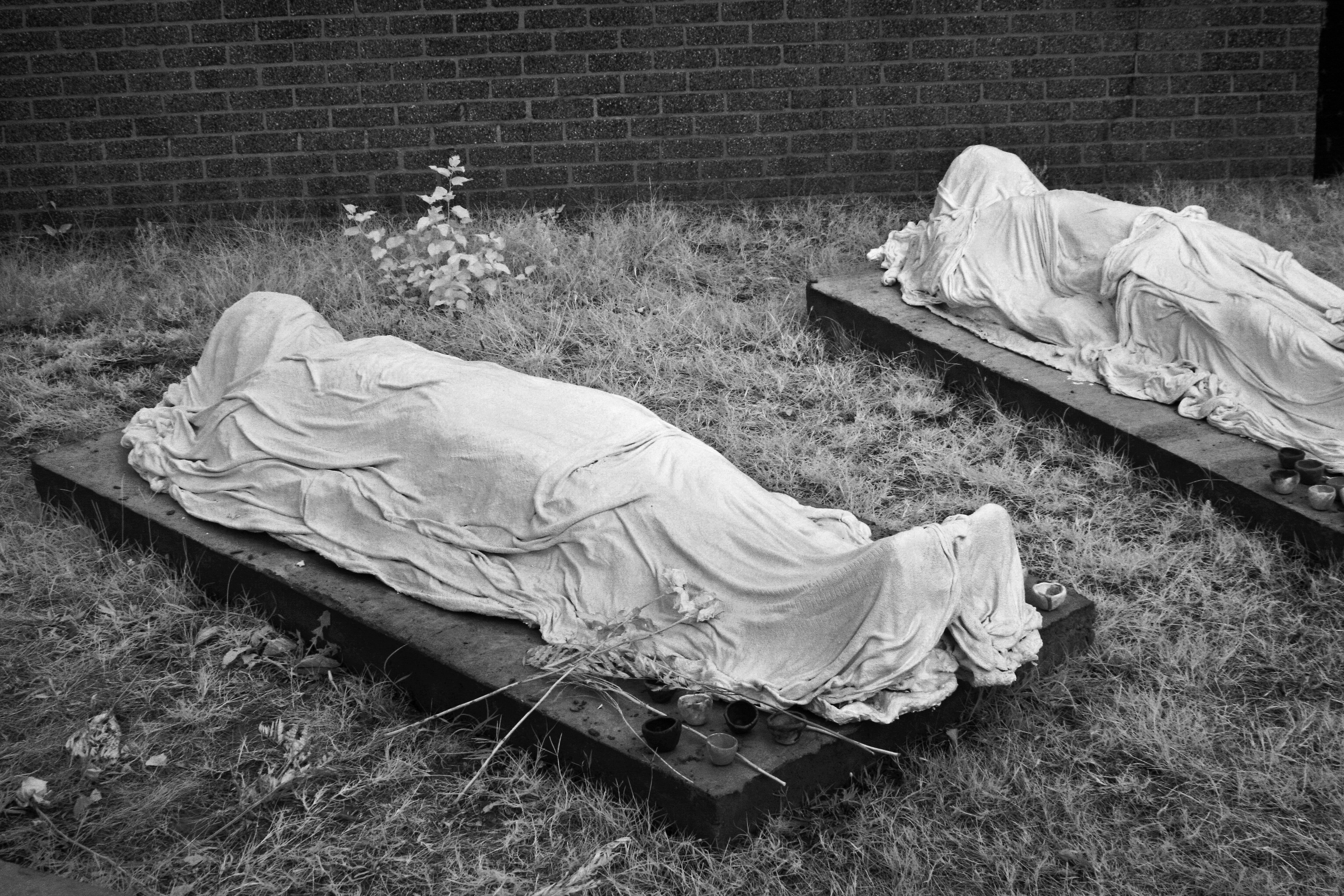 "The Dead" --- An artistic representation of a funeral scene.