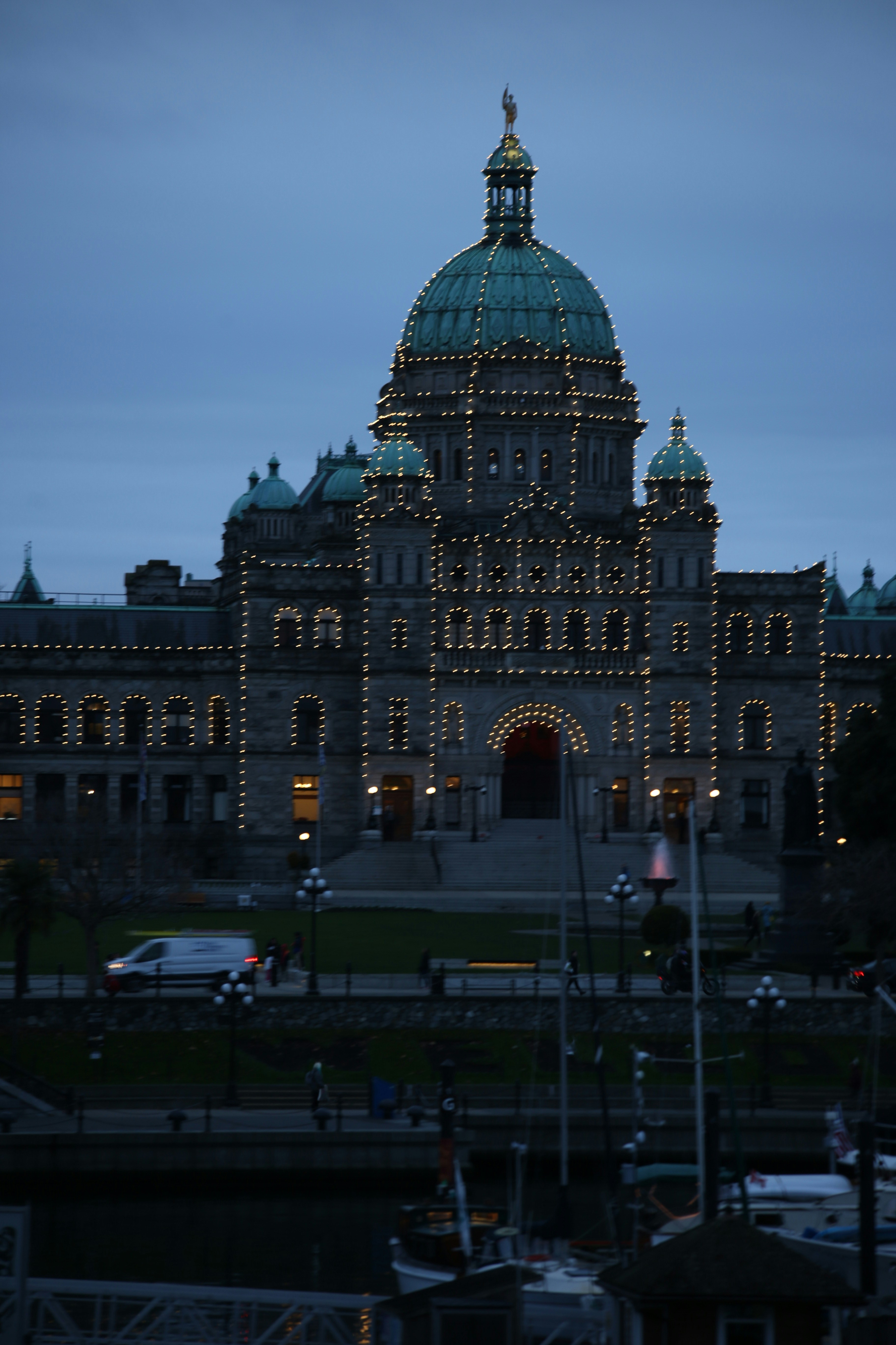 Grand building illuminated with festive lights at dusk photo – Free ...