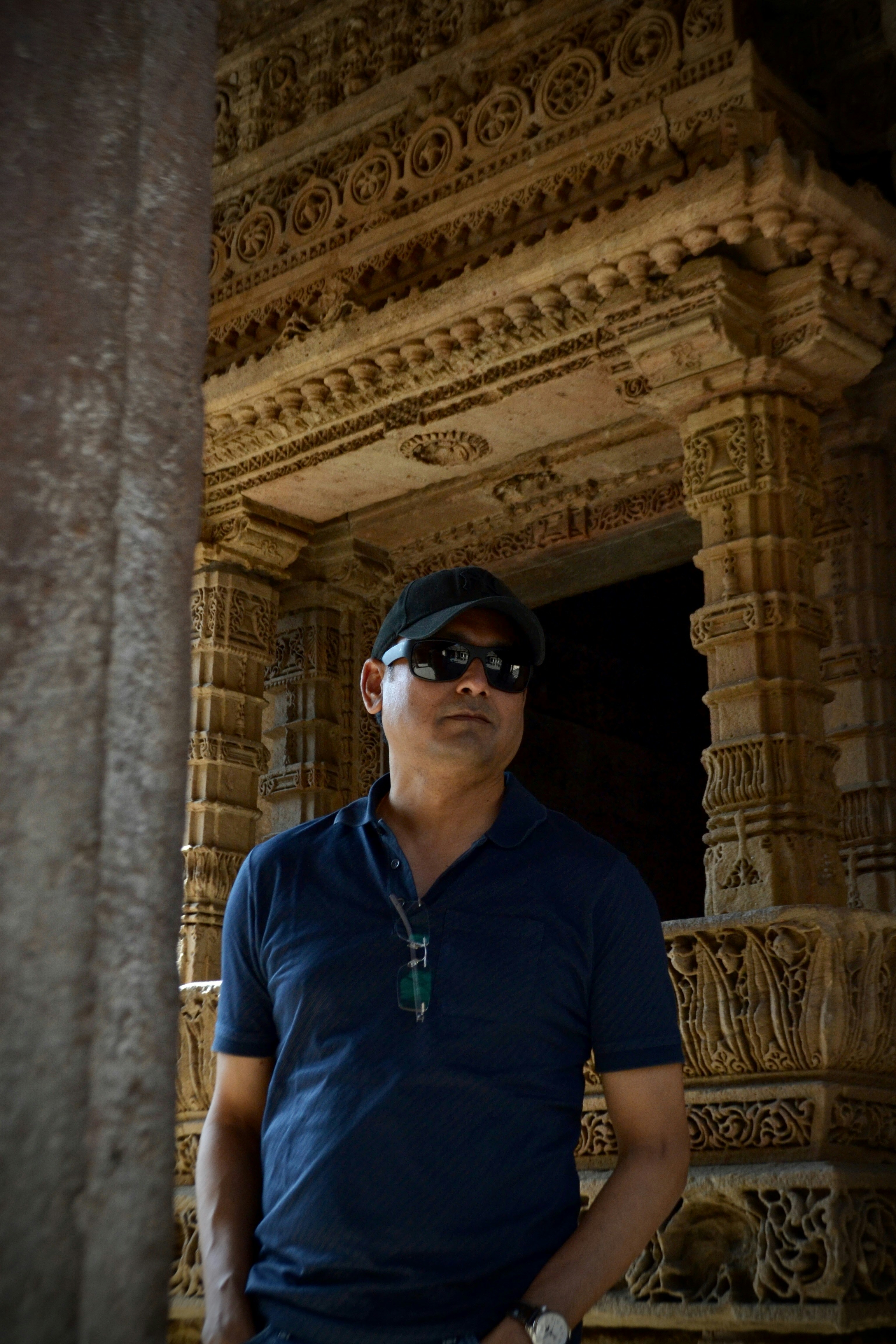 Stone Guardian: Portrait Beneath Intricate Carvings