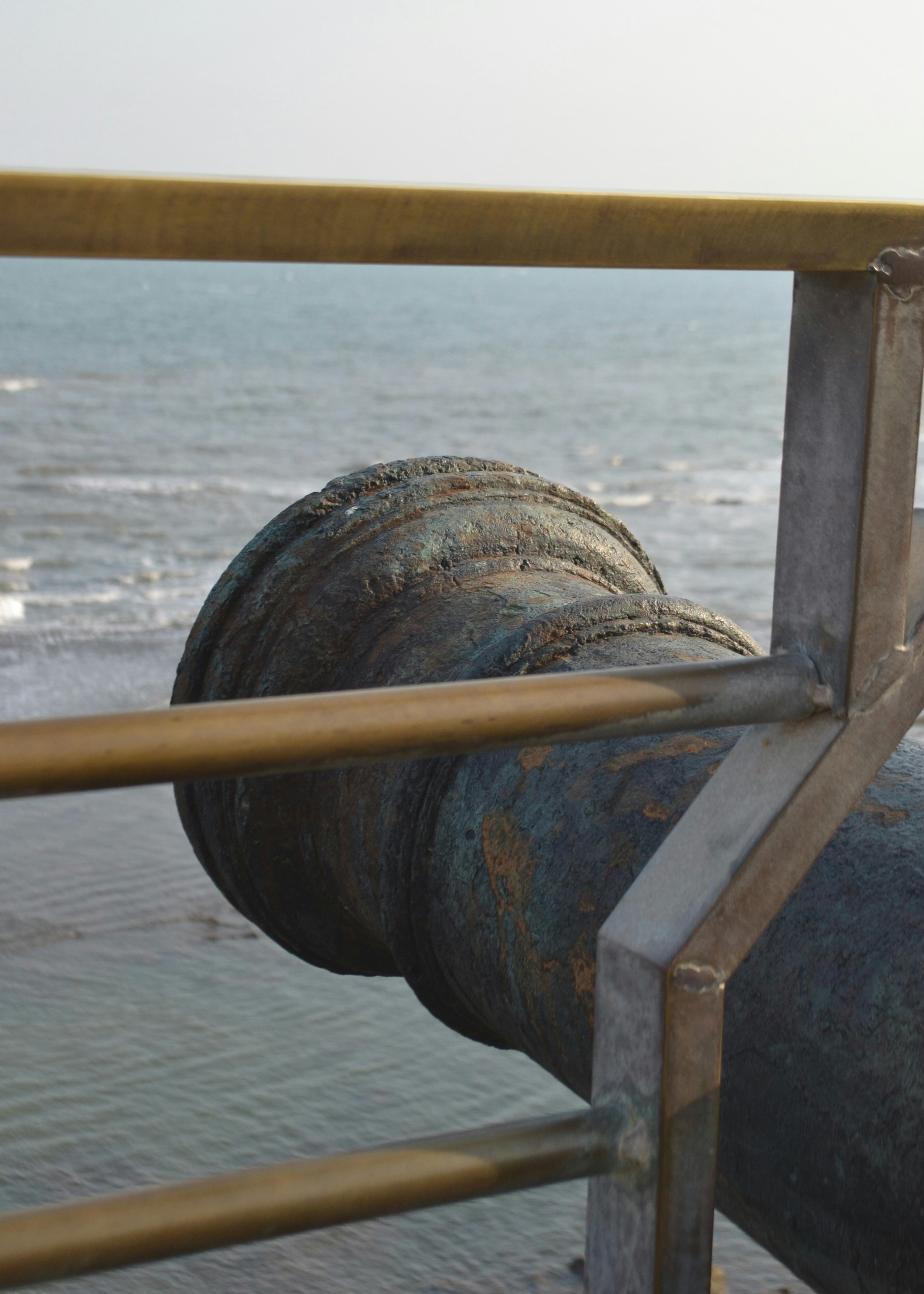 Rusted mooring gear by the sea: weathered textures and lines