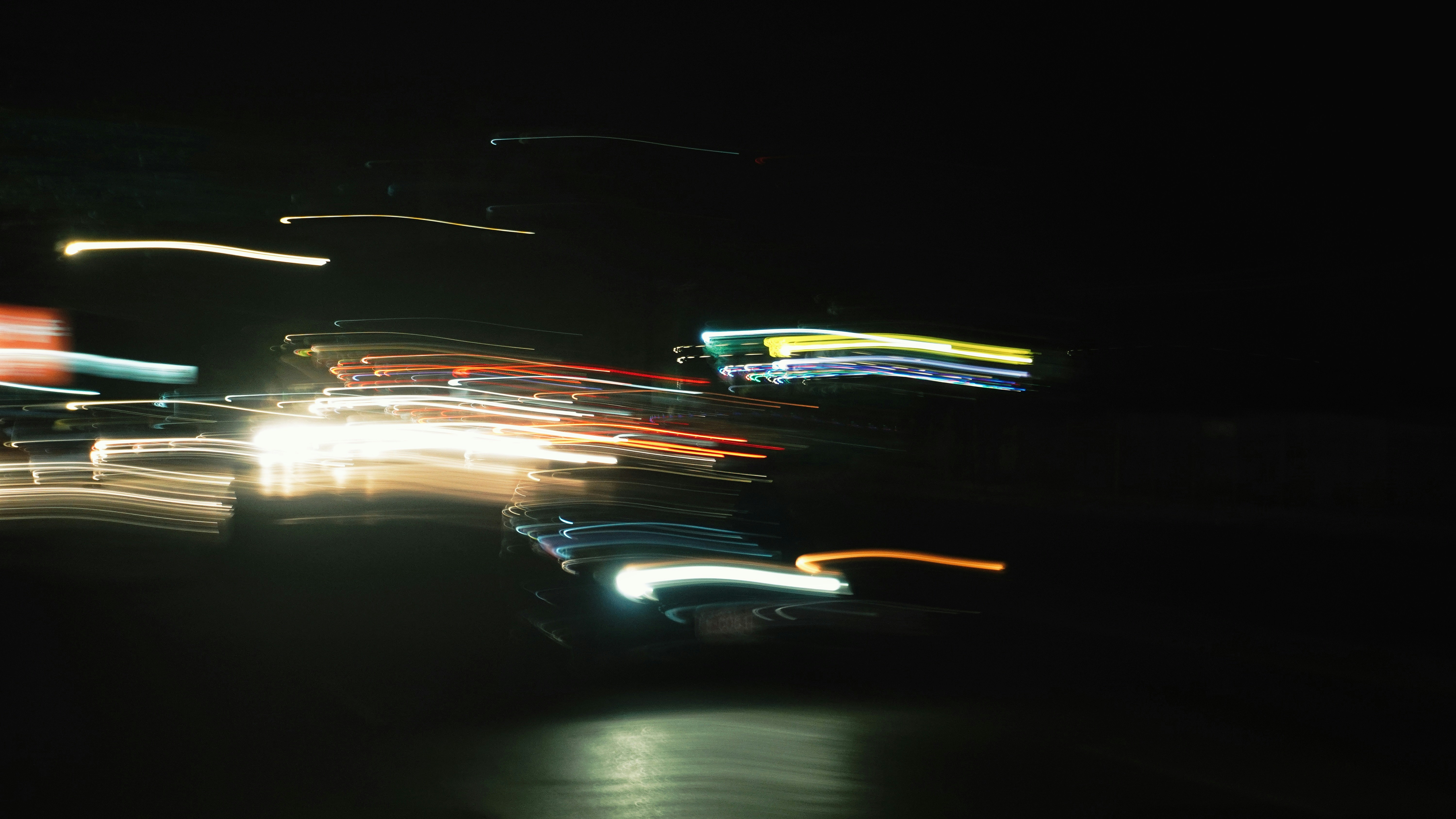 Neon Ribbons in Midnight Traffic