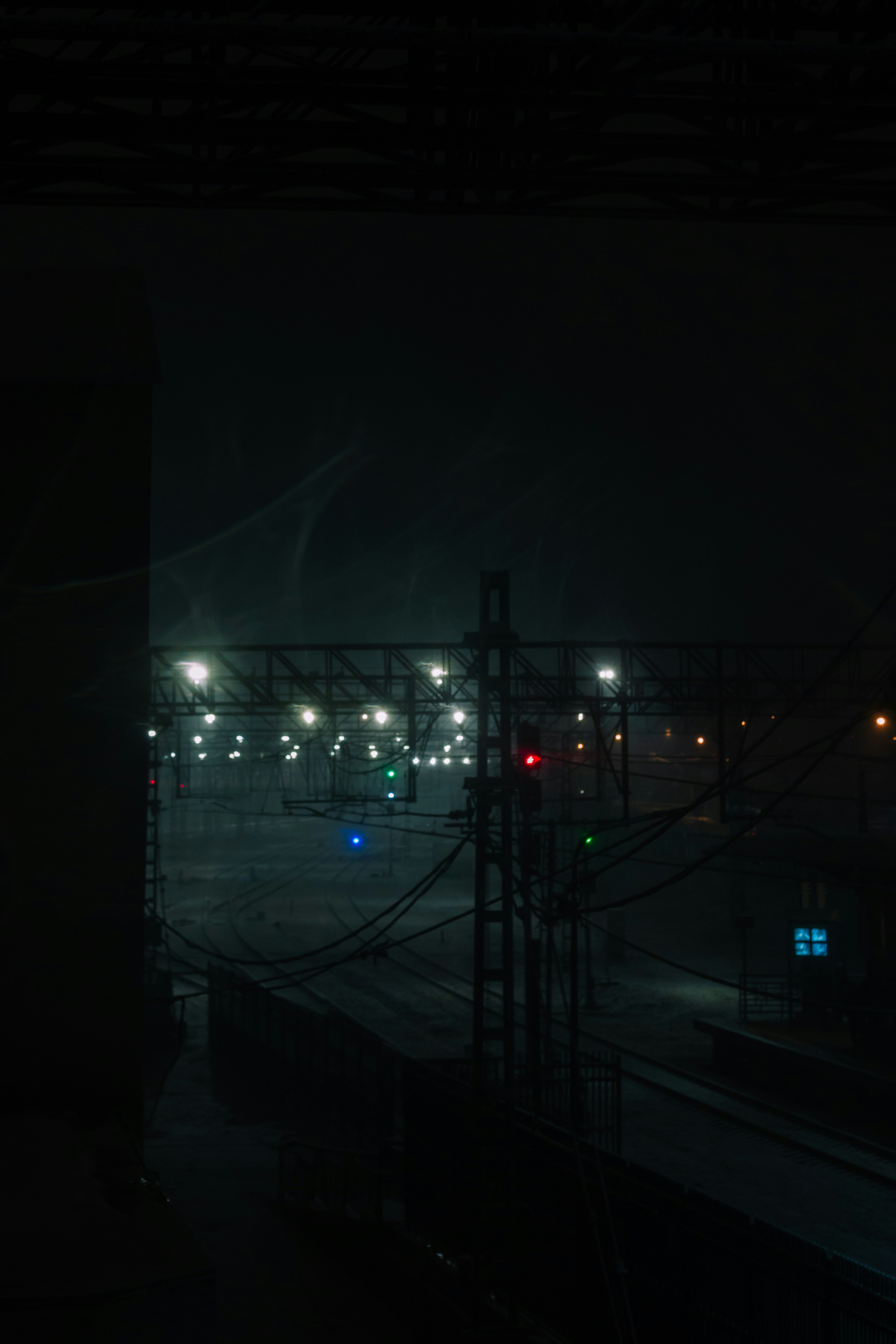 Neon Signals Thread the Fog Over Quiet Tracks