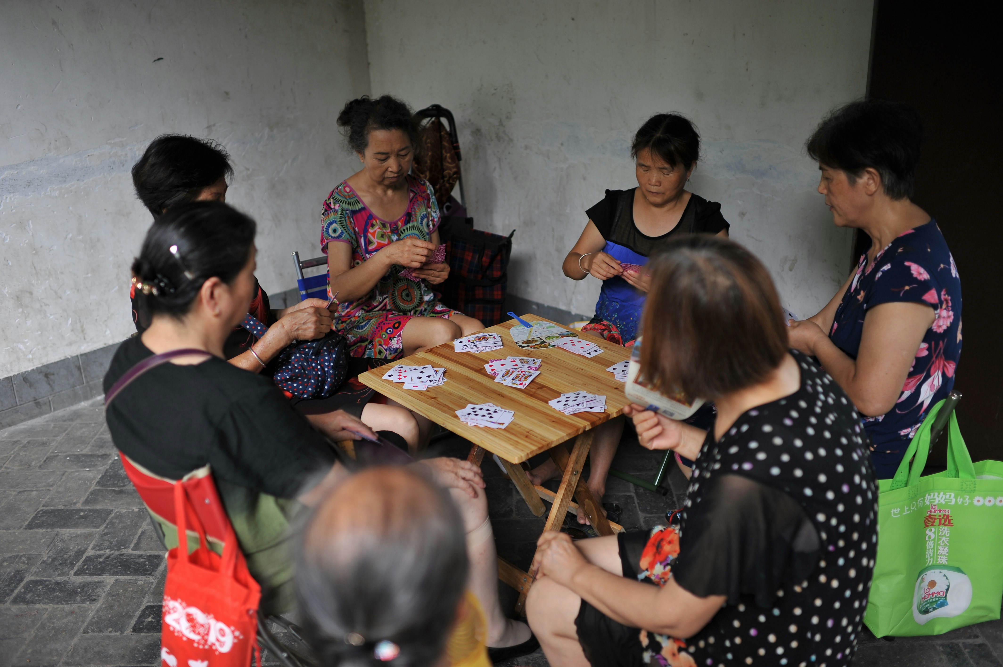 Women playing cards around a table photo – Free Retirement Image on ...