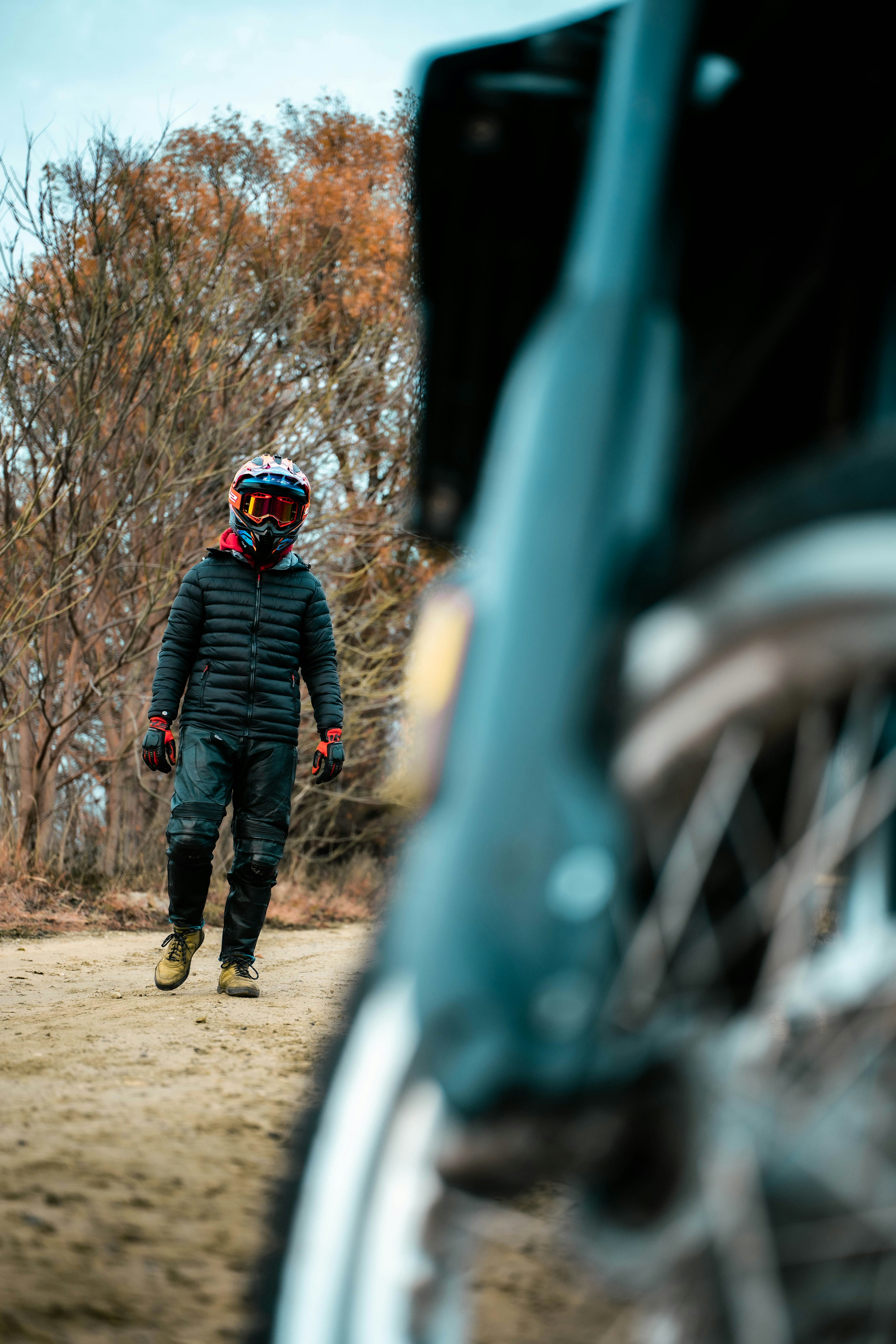 Autumn Standstill: A Lone Rider Framed by Foreground Blur