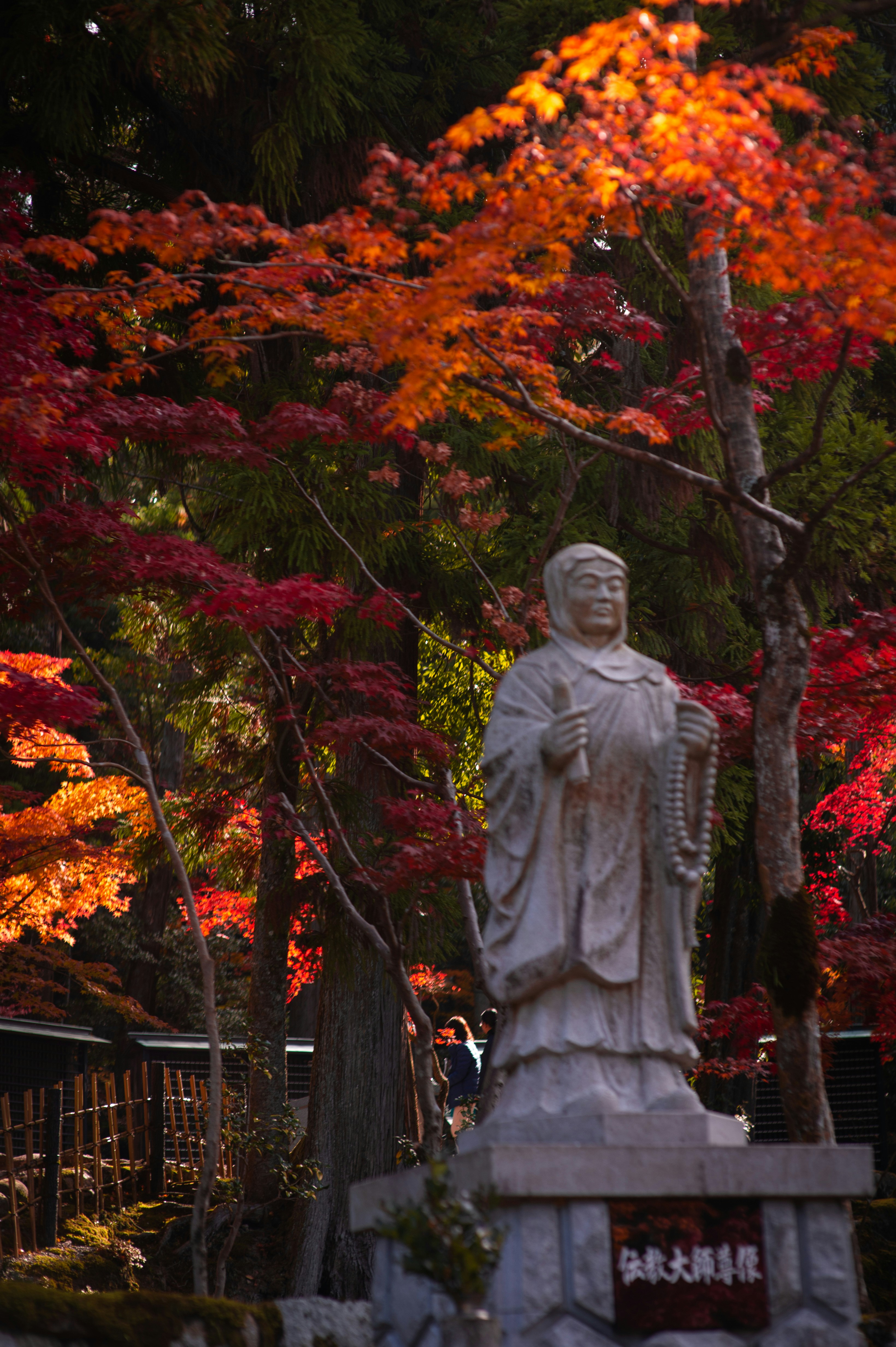 Stone Monk in a Garden of Autumn Fire