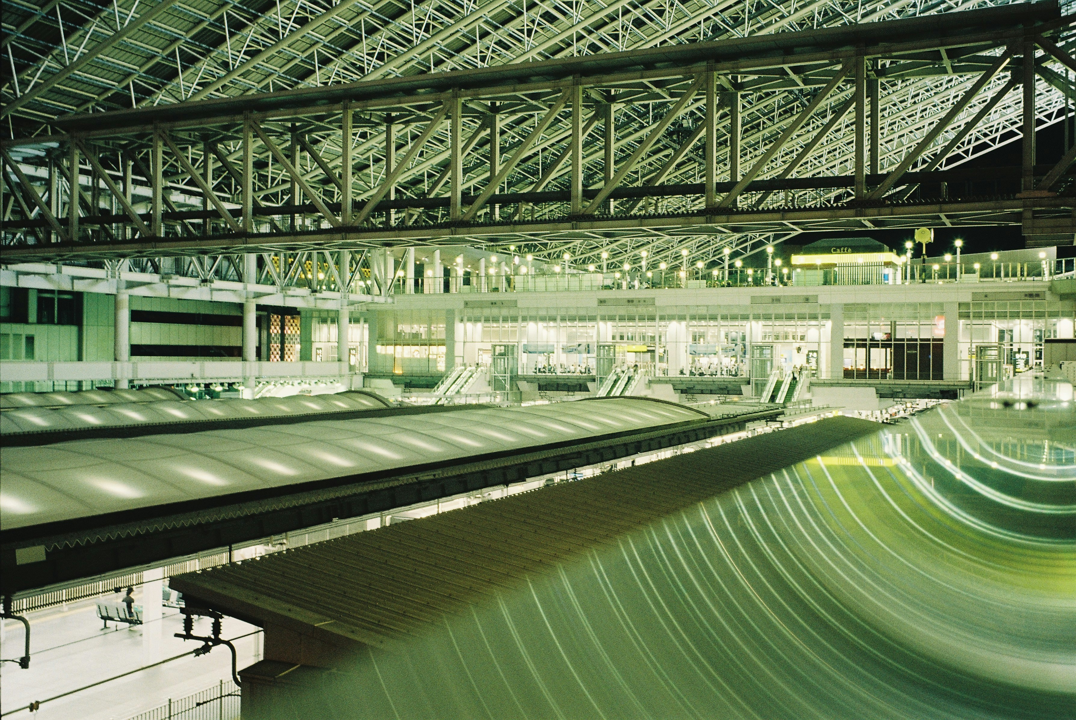 Green Arc Over Steel: A Long-Exposure Look at a Transit Hub