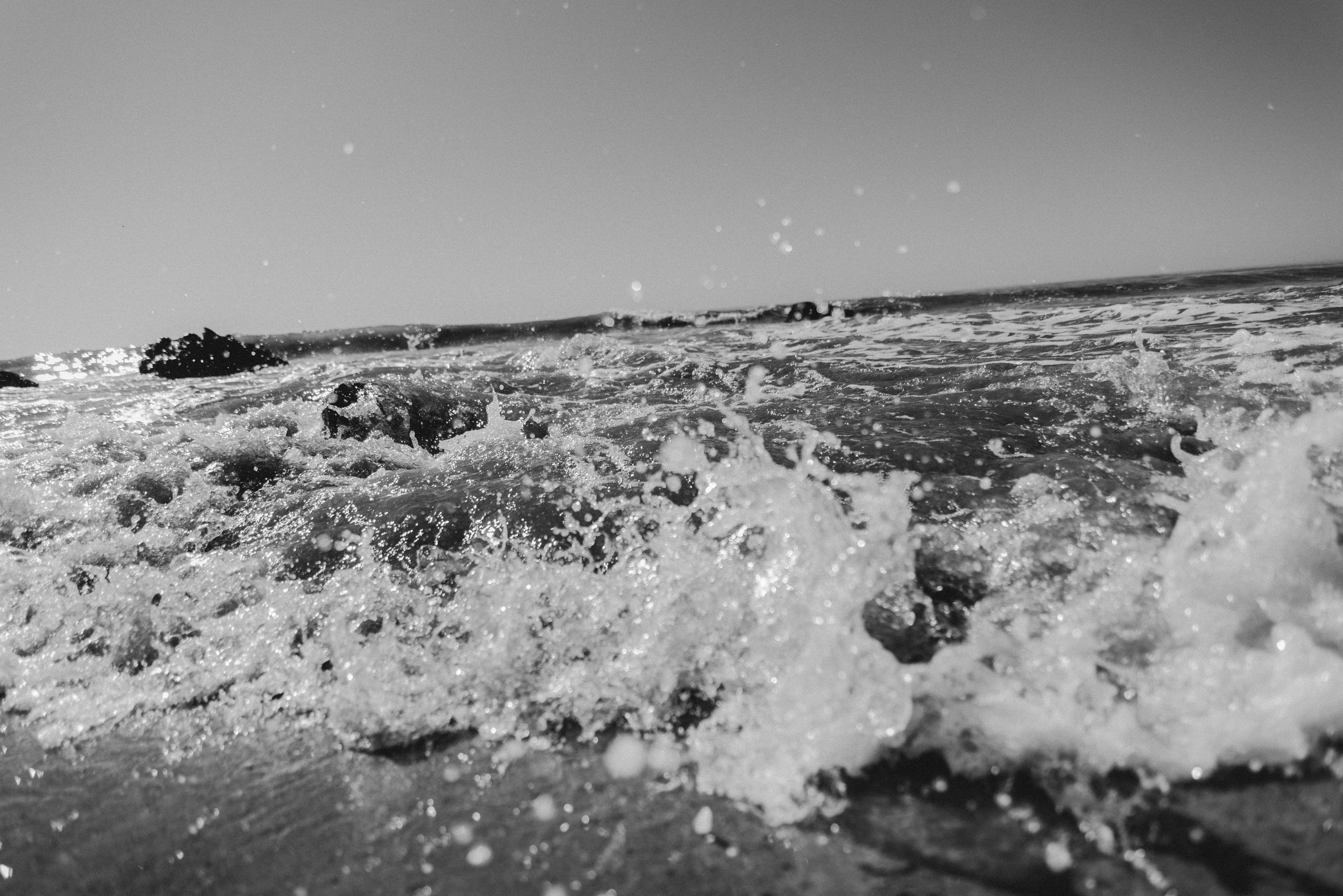 Foam Edge at Eye Level: A Monochrome Seascape