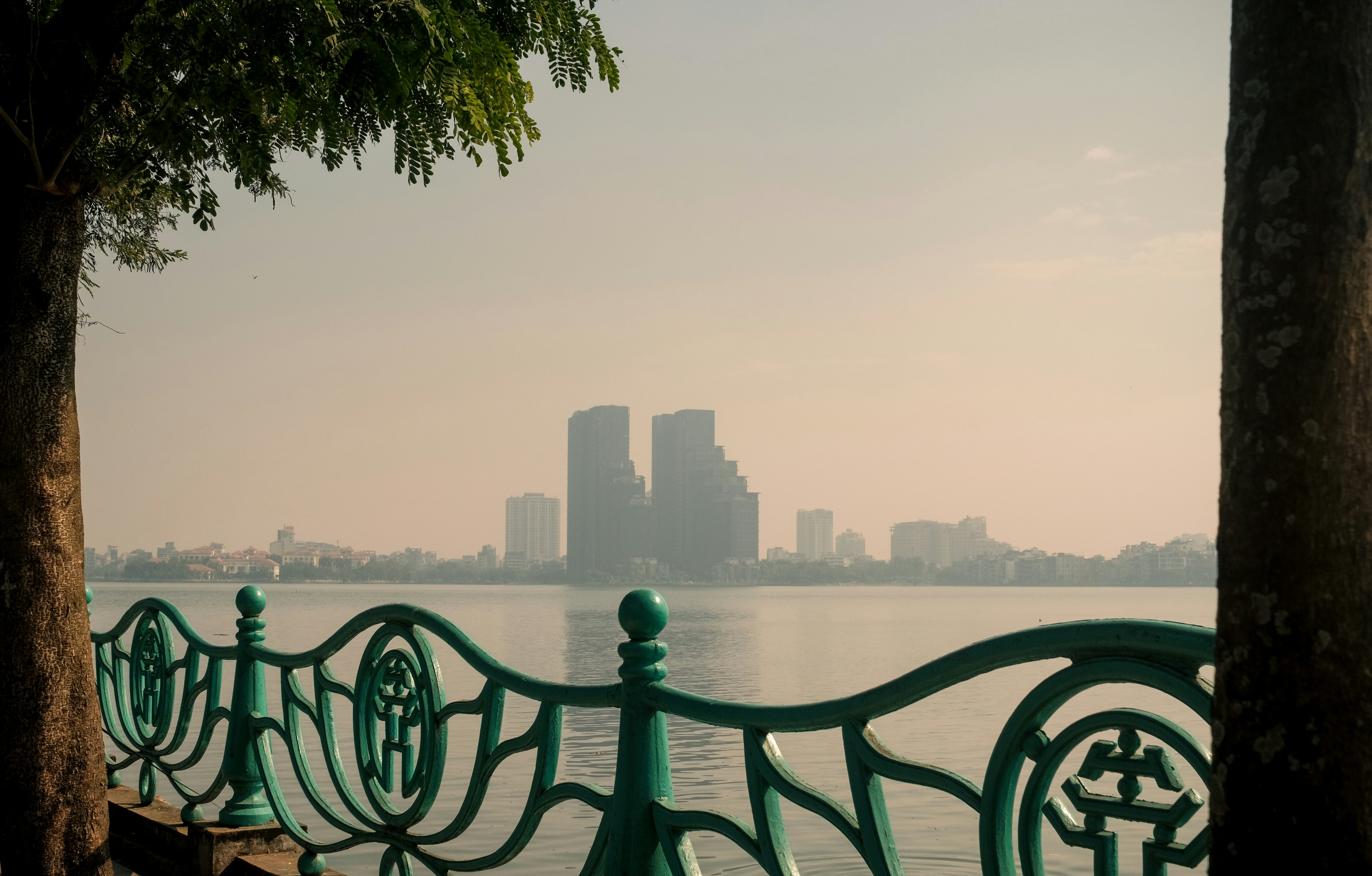 Horizon in Teal: City Silhouette Across a Quiet Waterfront