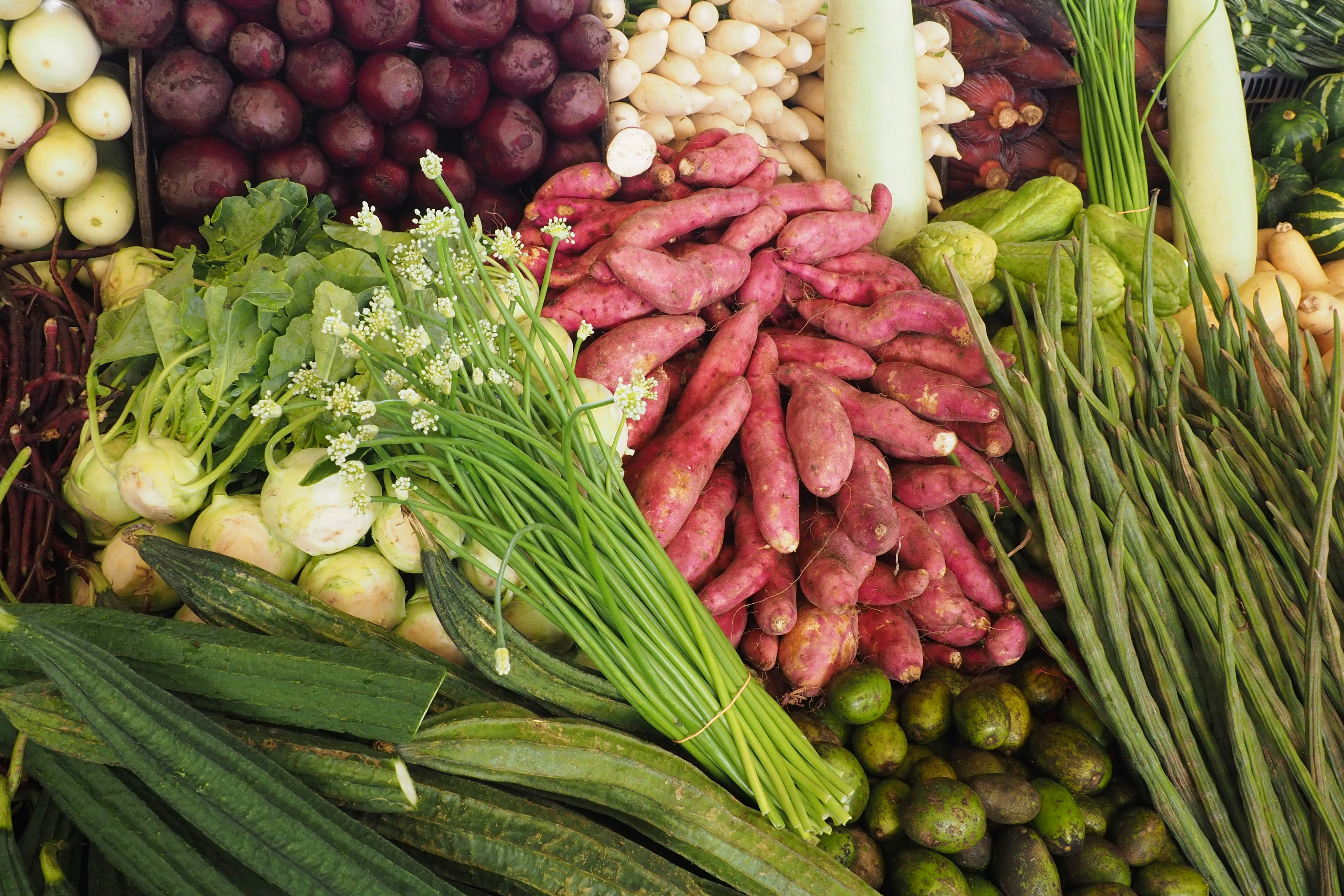 Centerpiece Carrots: Pink Roots at a Bustling Market Core