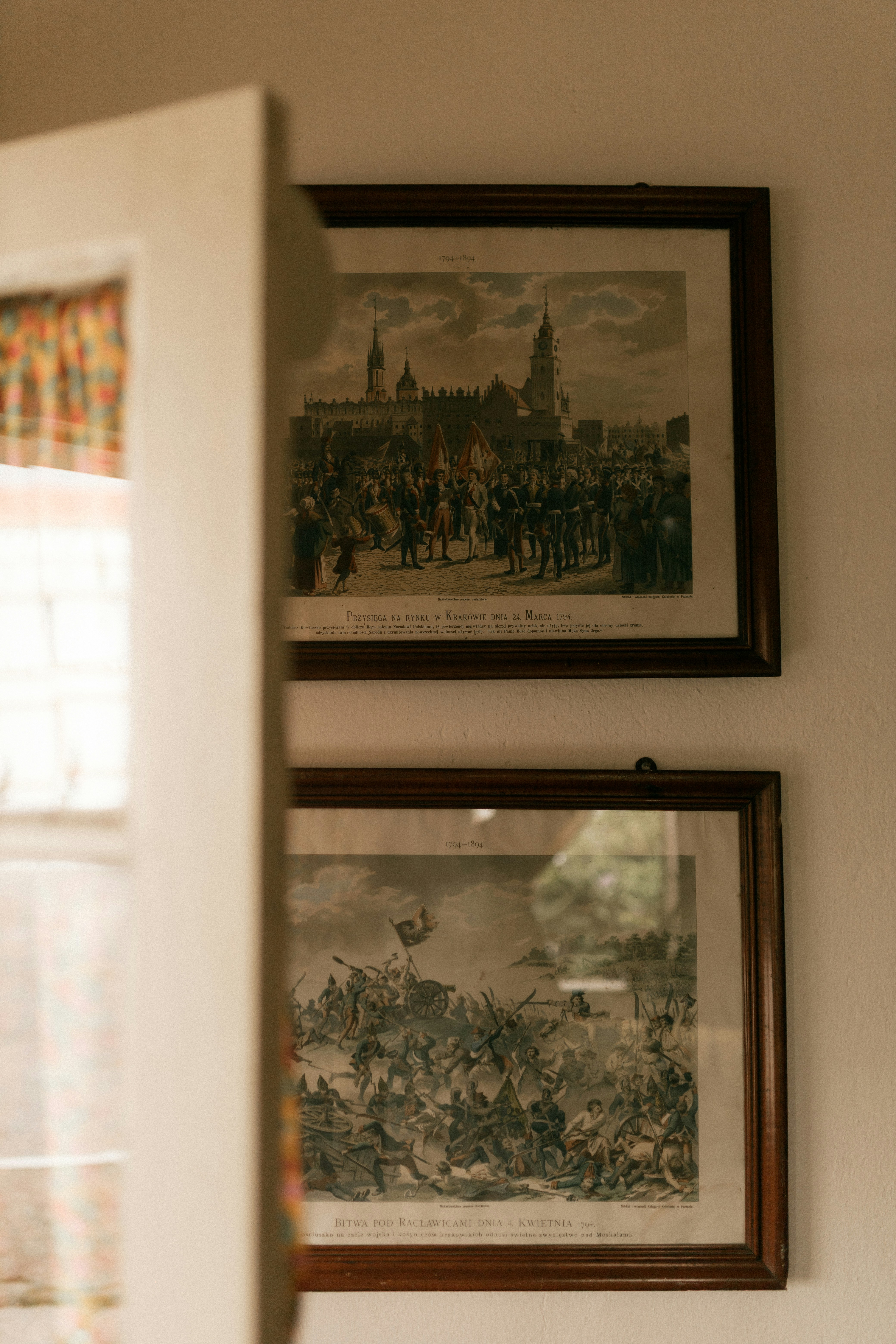 Doorway of History: Two Vintage Engravings Framed on a Quiet Wall