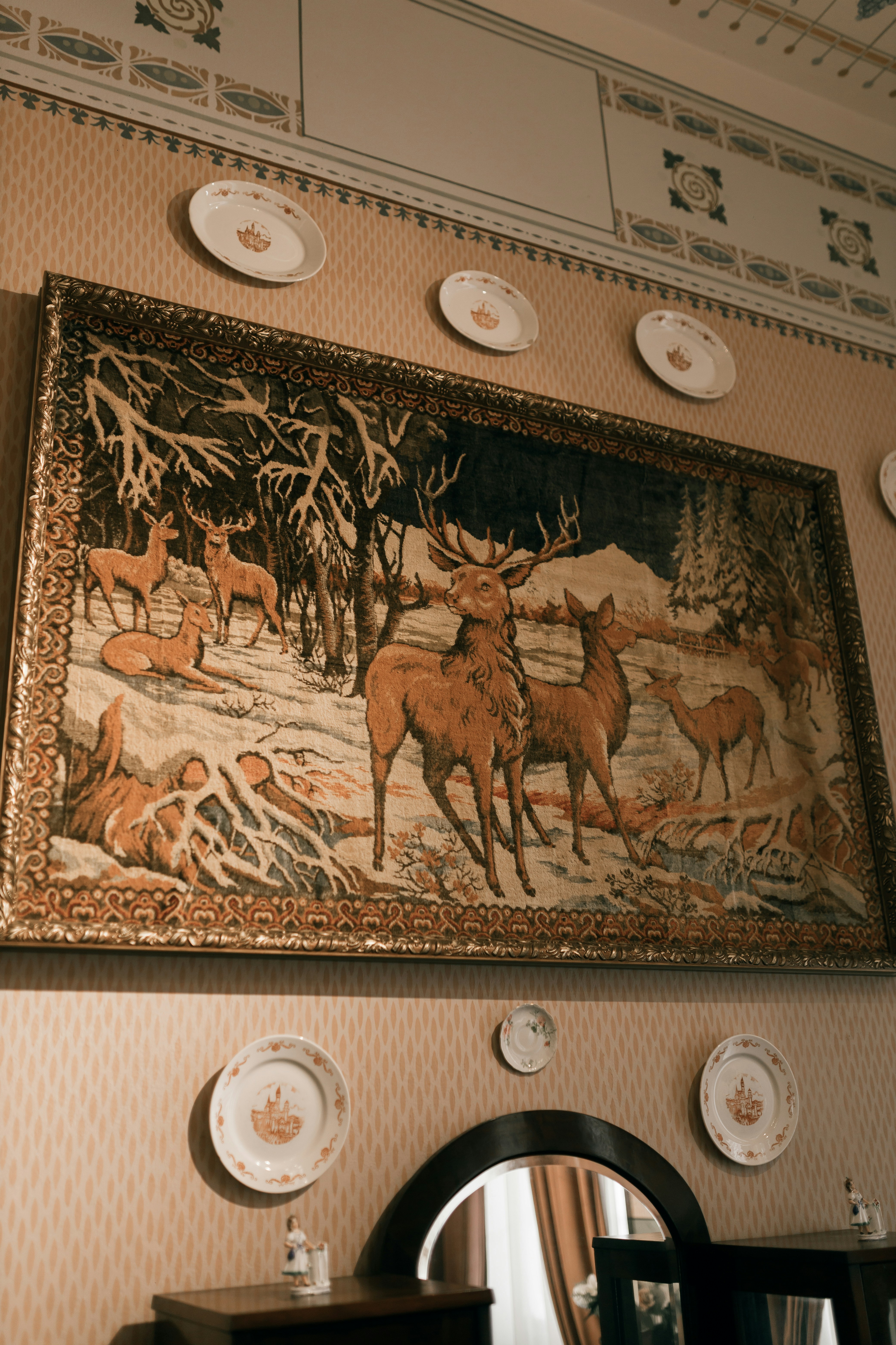 Deer in the Parlor: A Vintage Wall Painting Framed by Plates