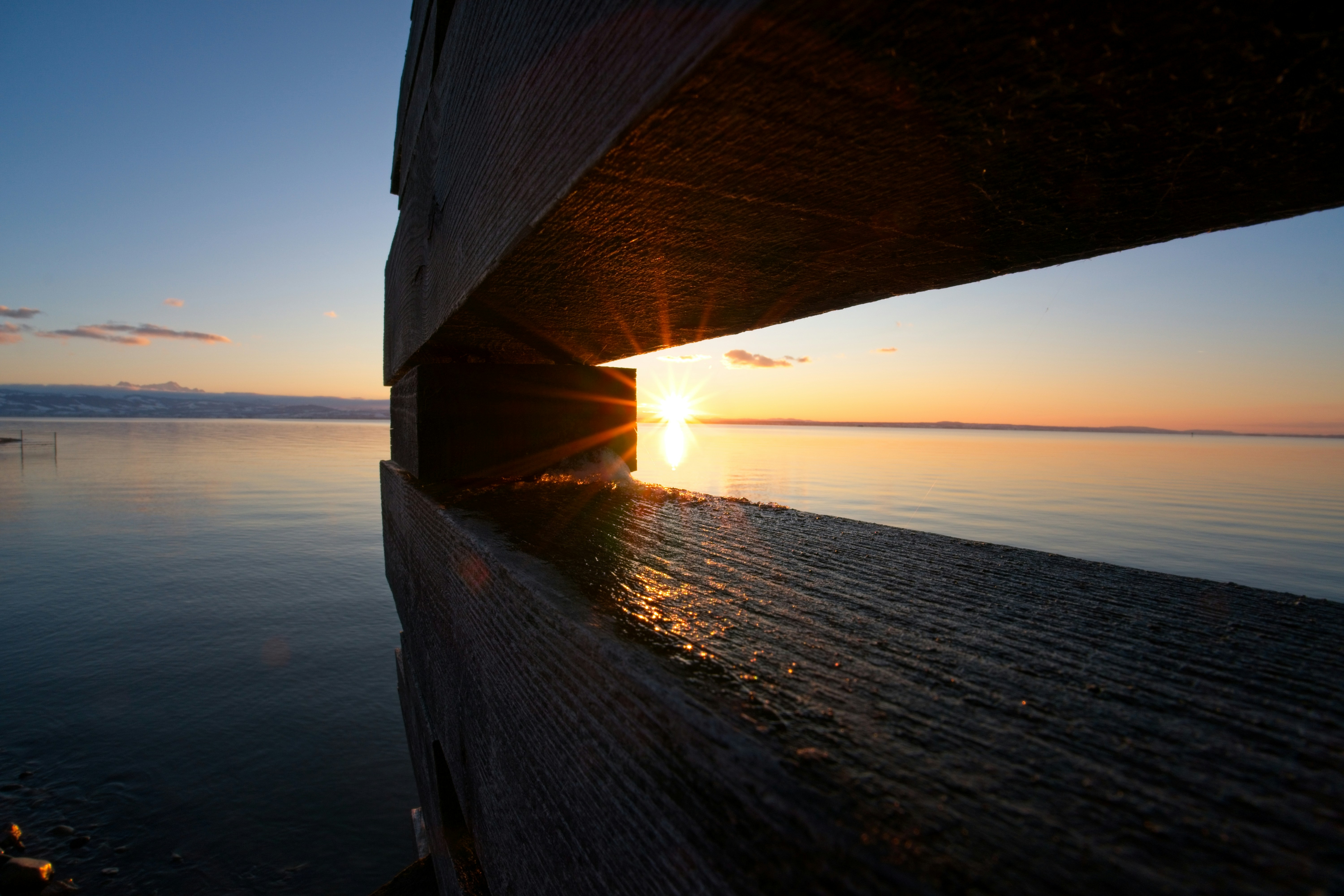 Sun Through the Gap: Sunset Between Weathered Beams