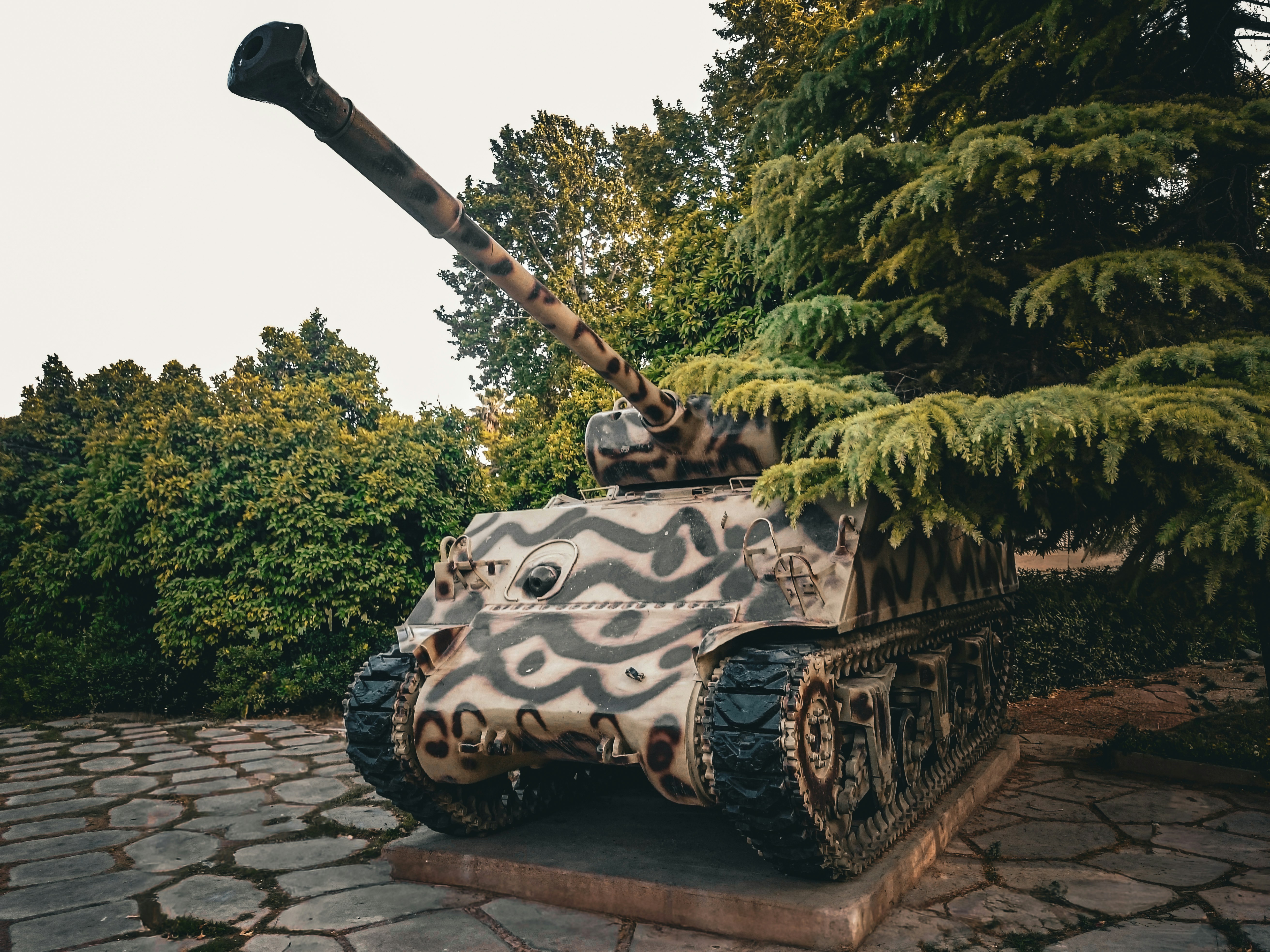 A36 Tank Display — Afif-Abad Military Museum — May 16, 2015 (#0043) This photograph captures a preserved A36 tank stationed in the outdoor courtyard of the Military Museum within the historic Afif-Abad Garden. Dating back to the Second World War era, this armored vehicle is equipped with an 8-cylinder engine. The image highlights the mechanical history and military heritage preserved within the garden complex, contrasting the heavy machinery with the serene garden environment. Sony Xperia Z1 (C6903) • 4.9 mm • f/2.0 • 1/125 s • ISO 50 Full-res download: mofaeye.com/43 (link in bio)