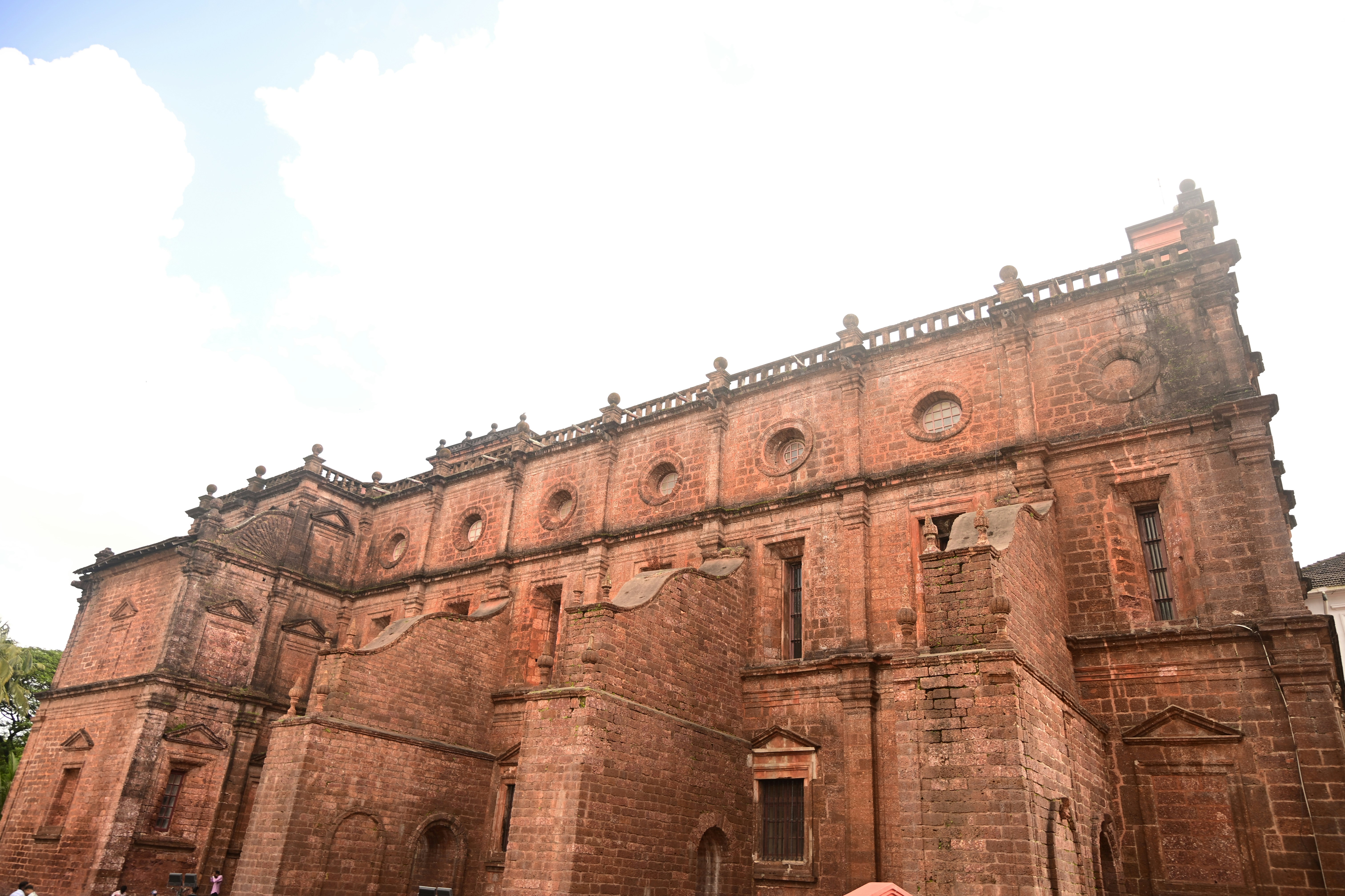 Red Brick Facade Rising Against a Pale Sky