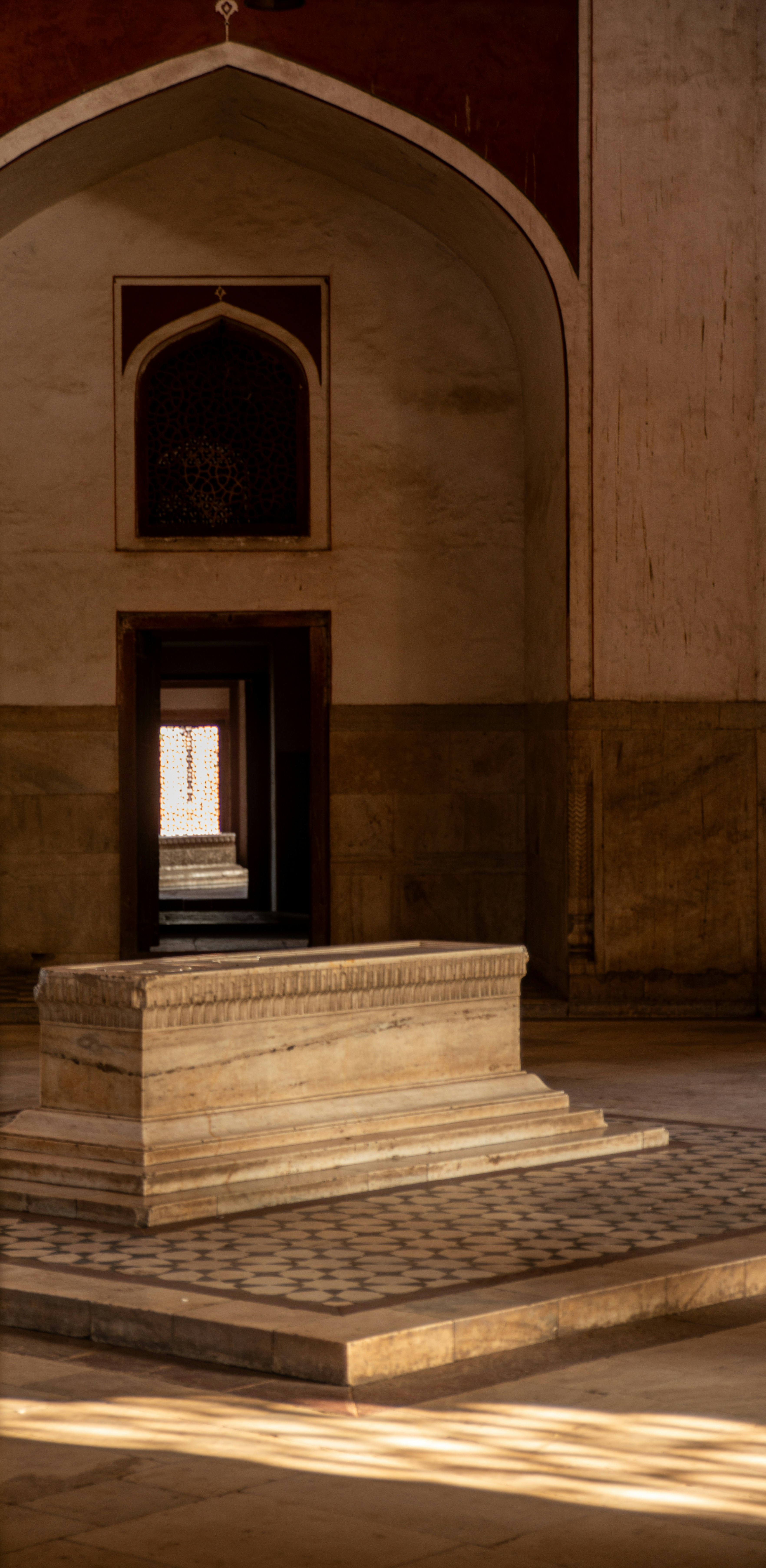 Inside Humayun's tomb, Delhi, India. The tomb was commissioned by Humayun's first wife and chief consort, Empress Bega Begum under her patronage in 1558, and designed by Mirak Mirza Ghiyas and his son, Sayyid Muhammad, Persian architects chosen by her.