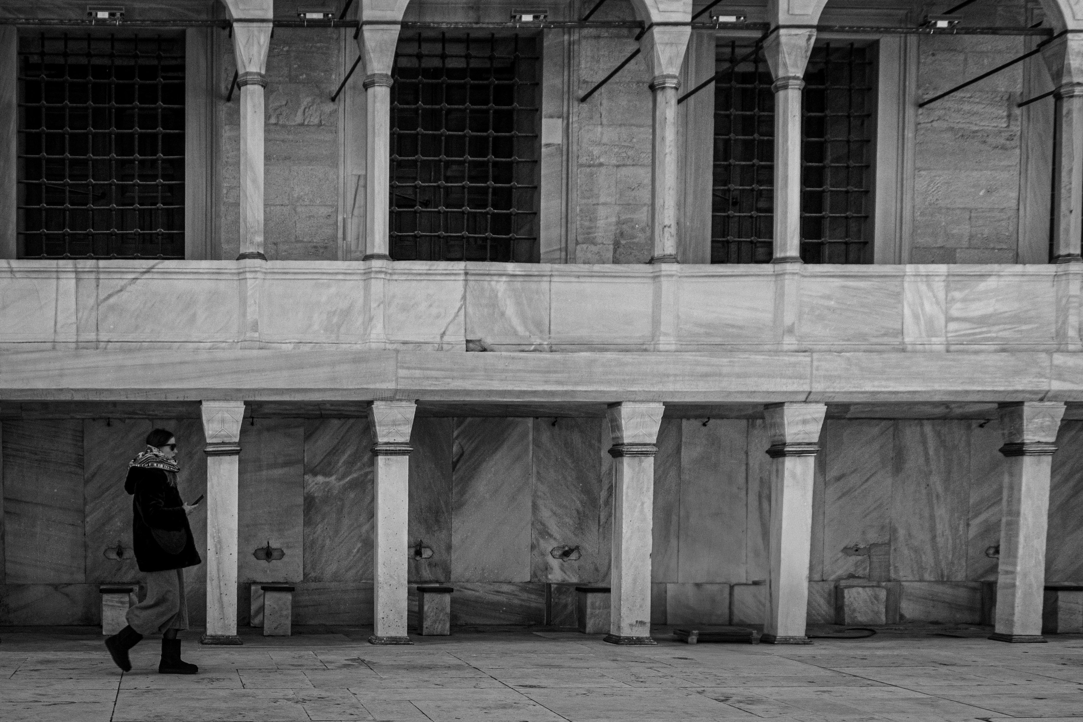 Historical Ottoman architecture details at the Blue Mosque (Sultan Ahmet Camii) in Istanbul. Monochrome street photography.