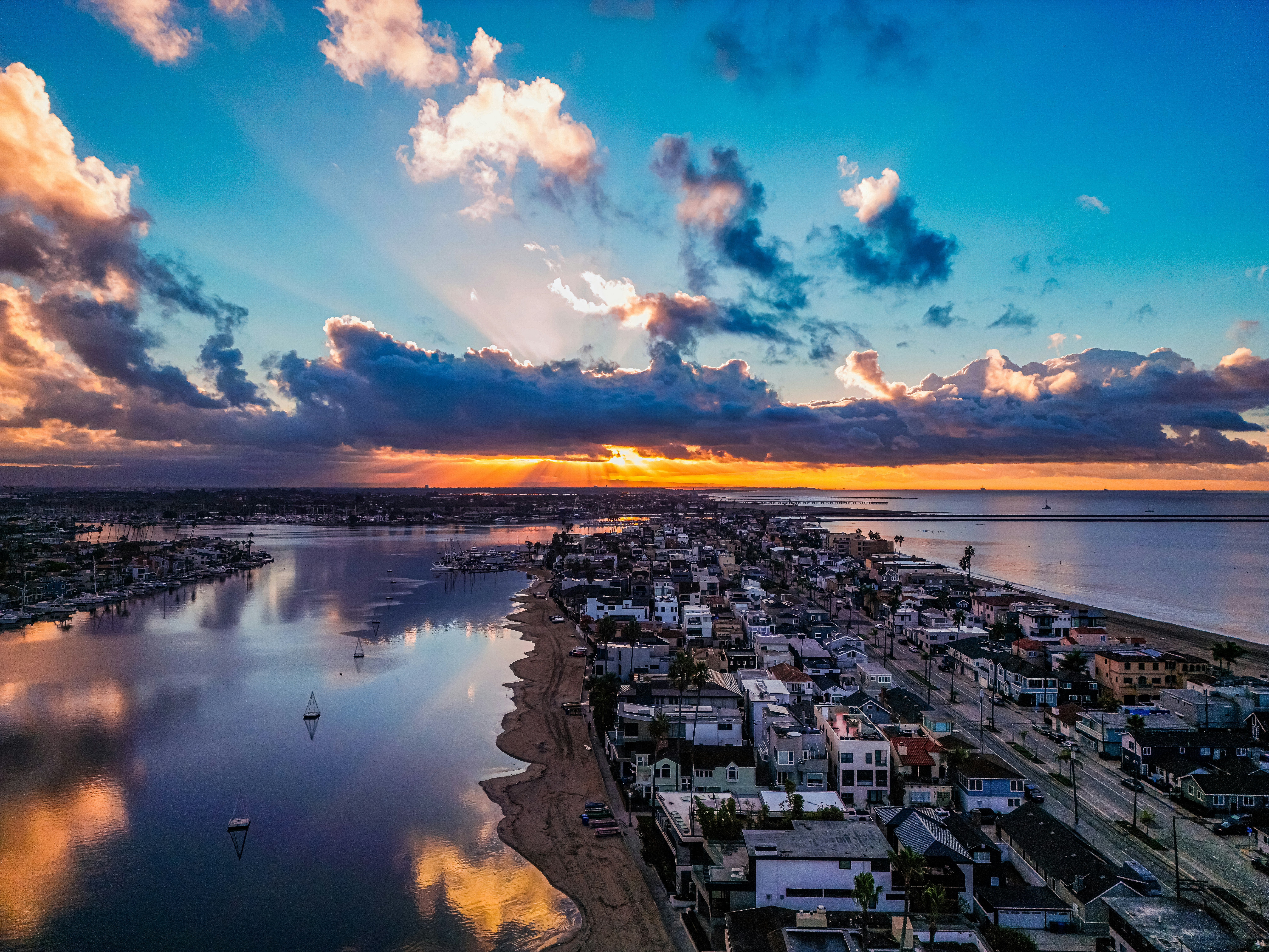 Horizon Lines: Sunset Reflections Over a Linear Coastal Town