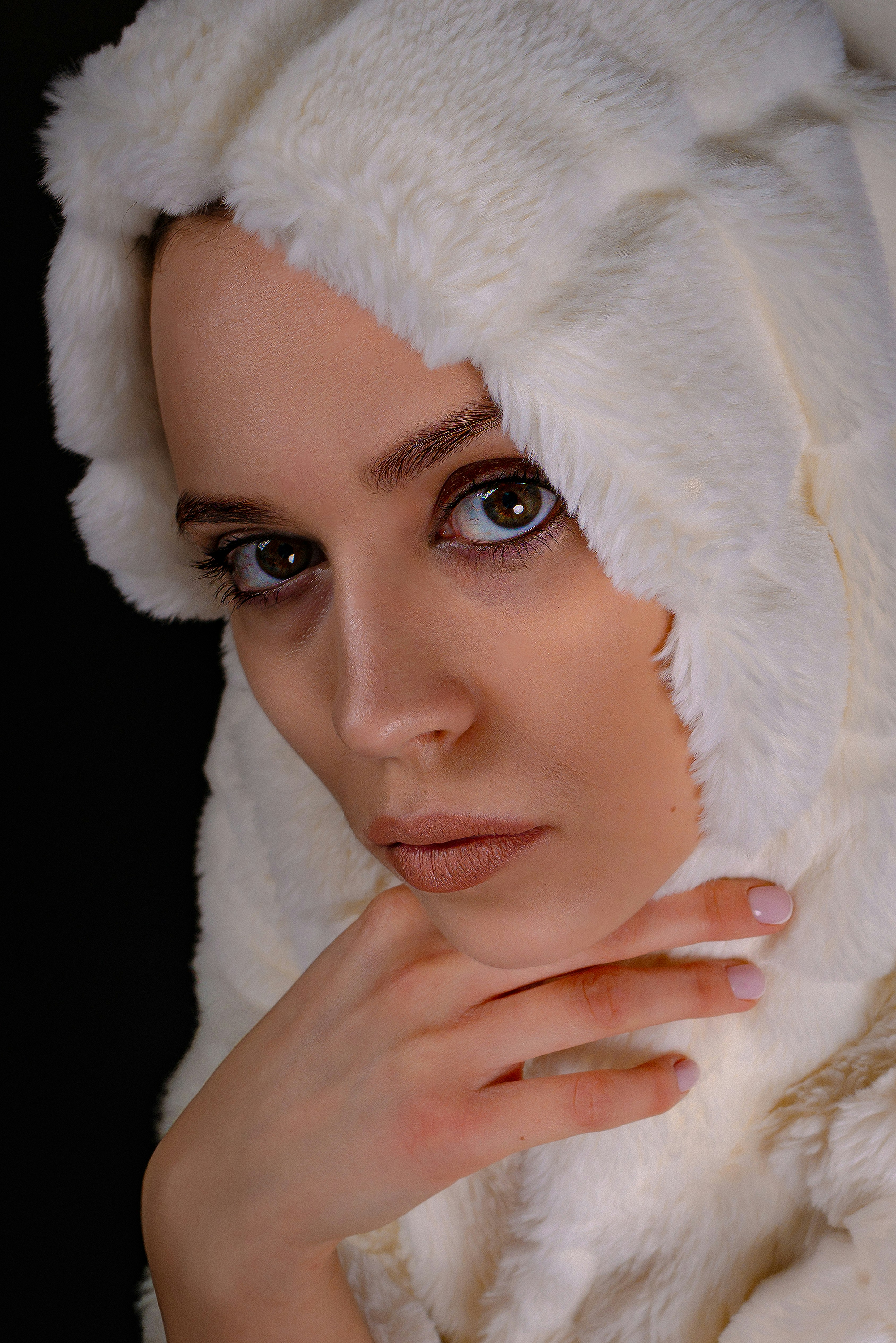 Glimmer Beneath the White Hood