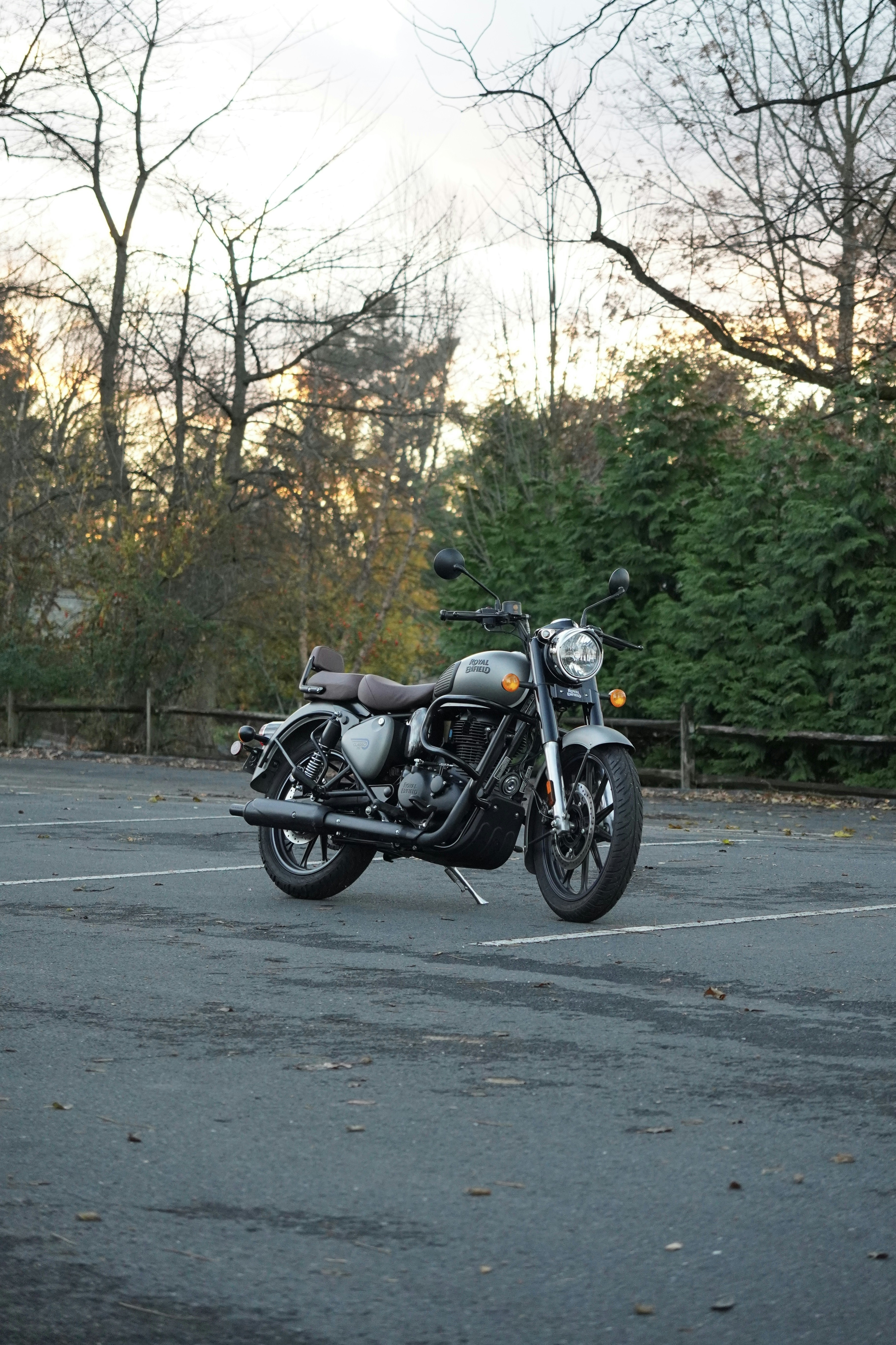 Matte Steel in the Quiet Lot: A Motorcycle's Autumn Standstill