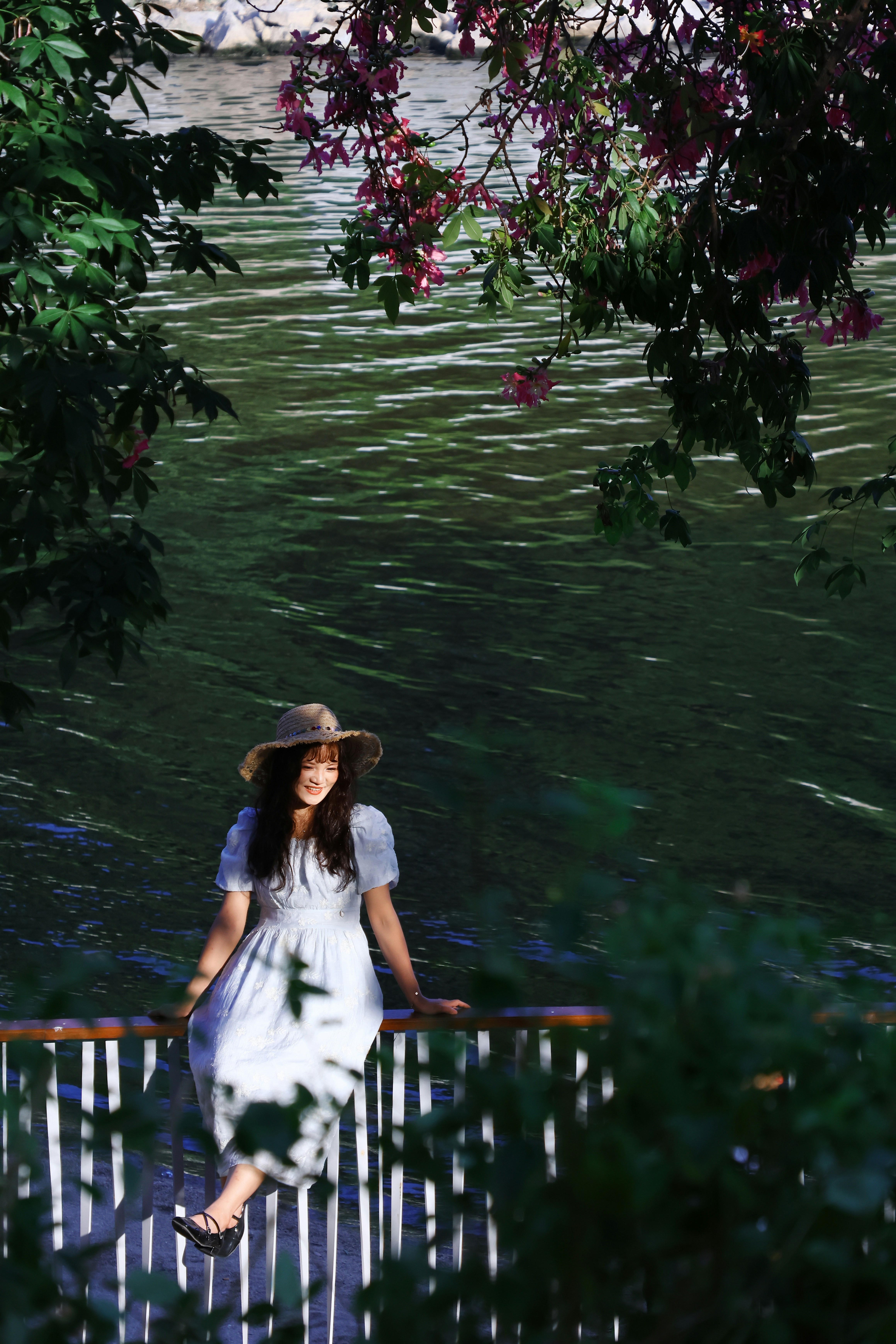Riverside Reverie Beneath Blooming Canopy