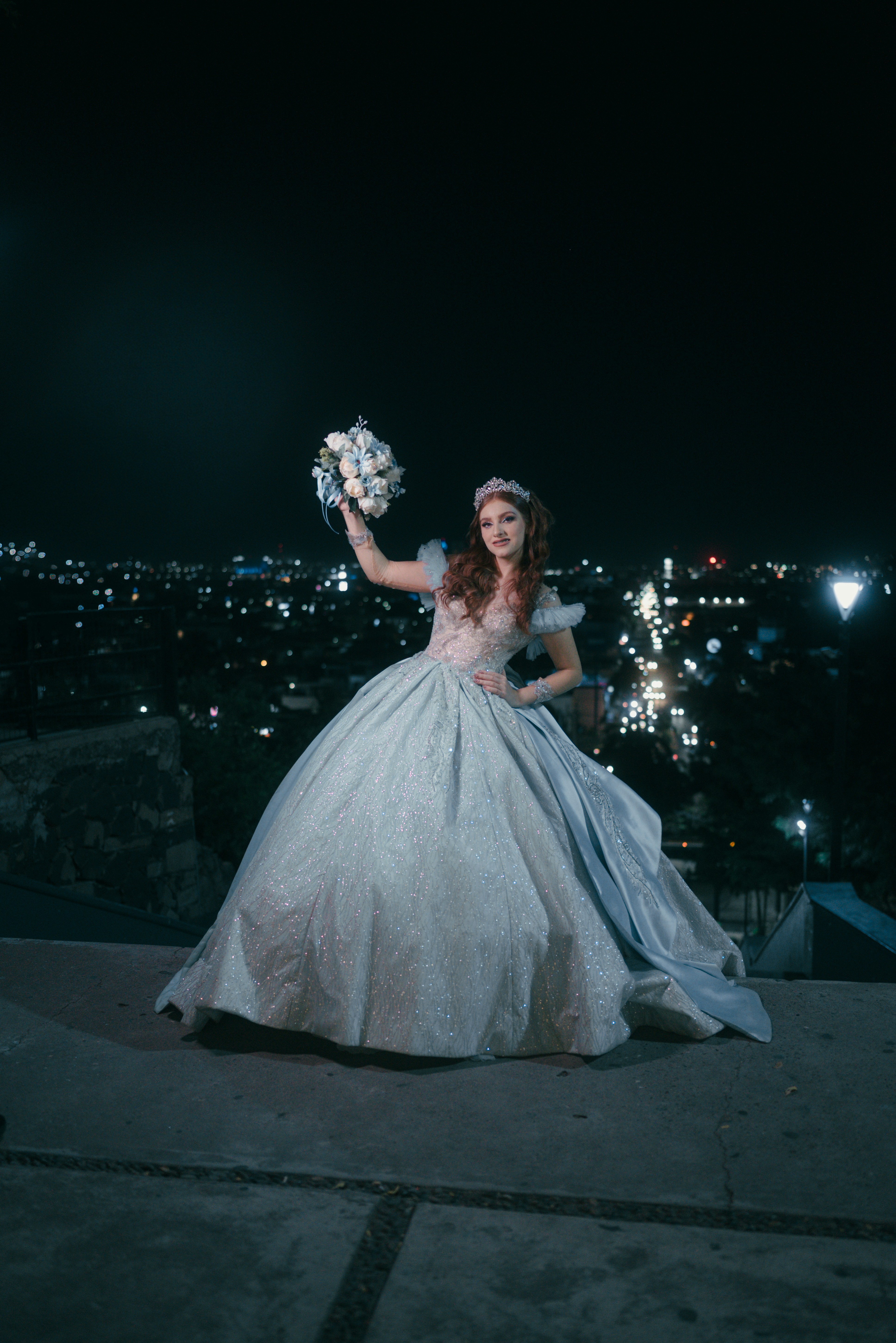 Moonlit Gown on a Rooftop: A Bride Surrounded by City Lights