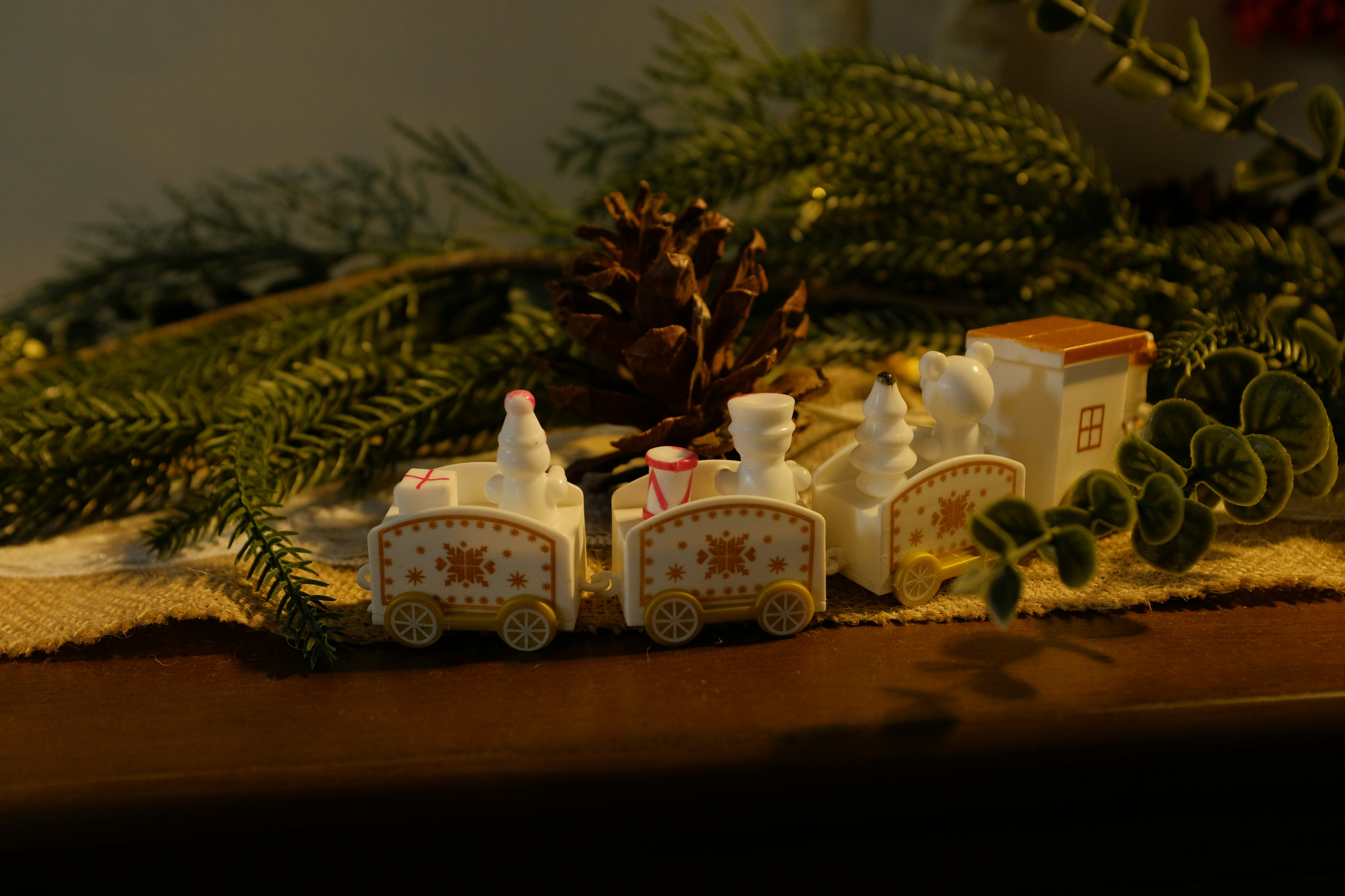 Tiny Porcelain Train on a Pine-Scented Holiday Shelf