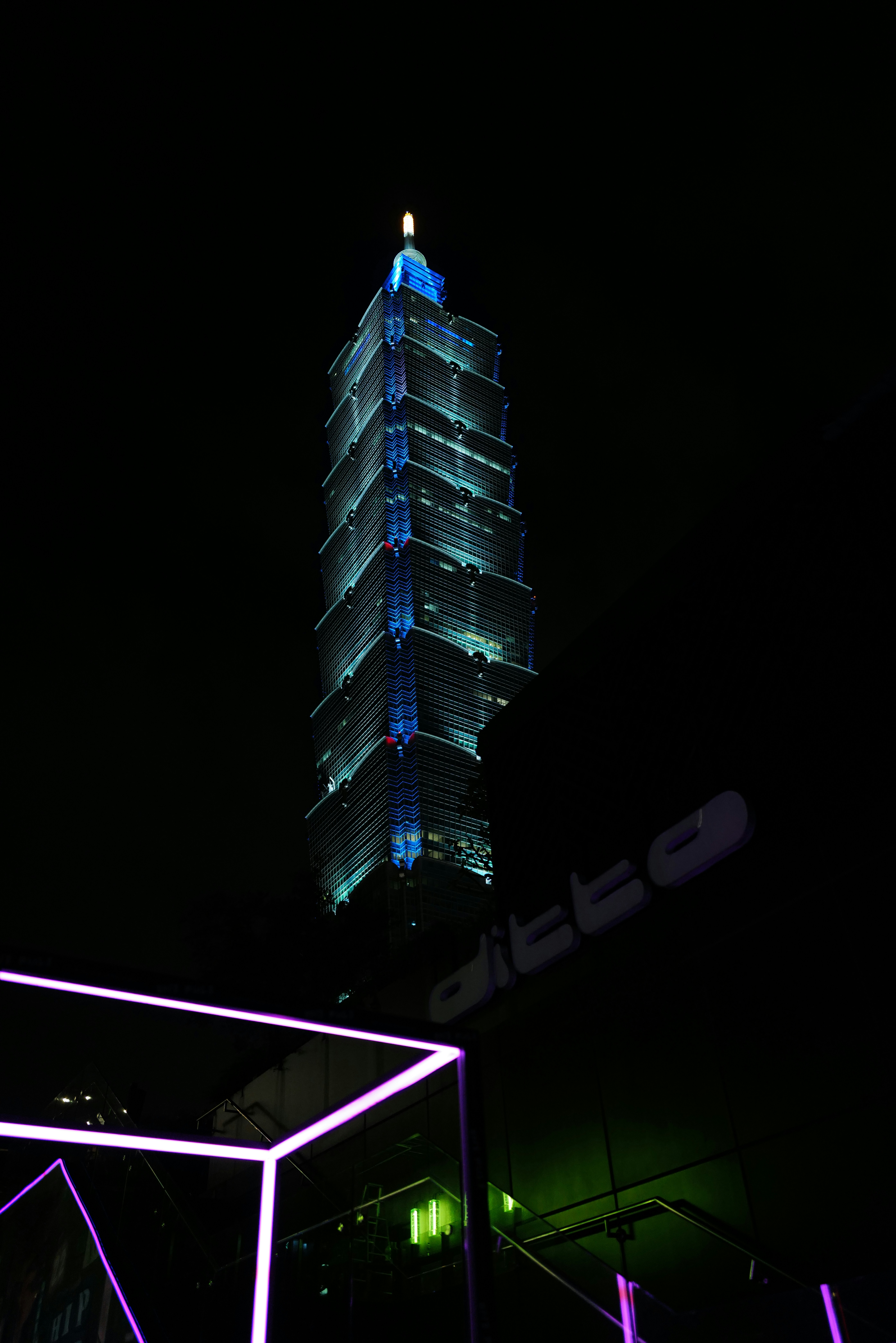 Blue Taipei 101 Rising Behind Neon Geometry