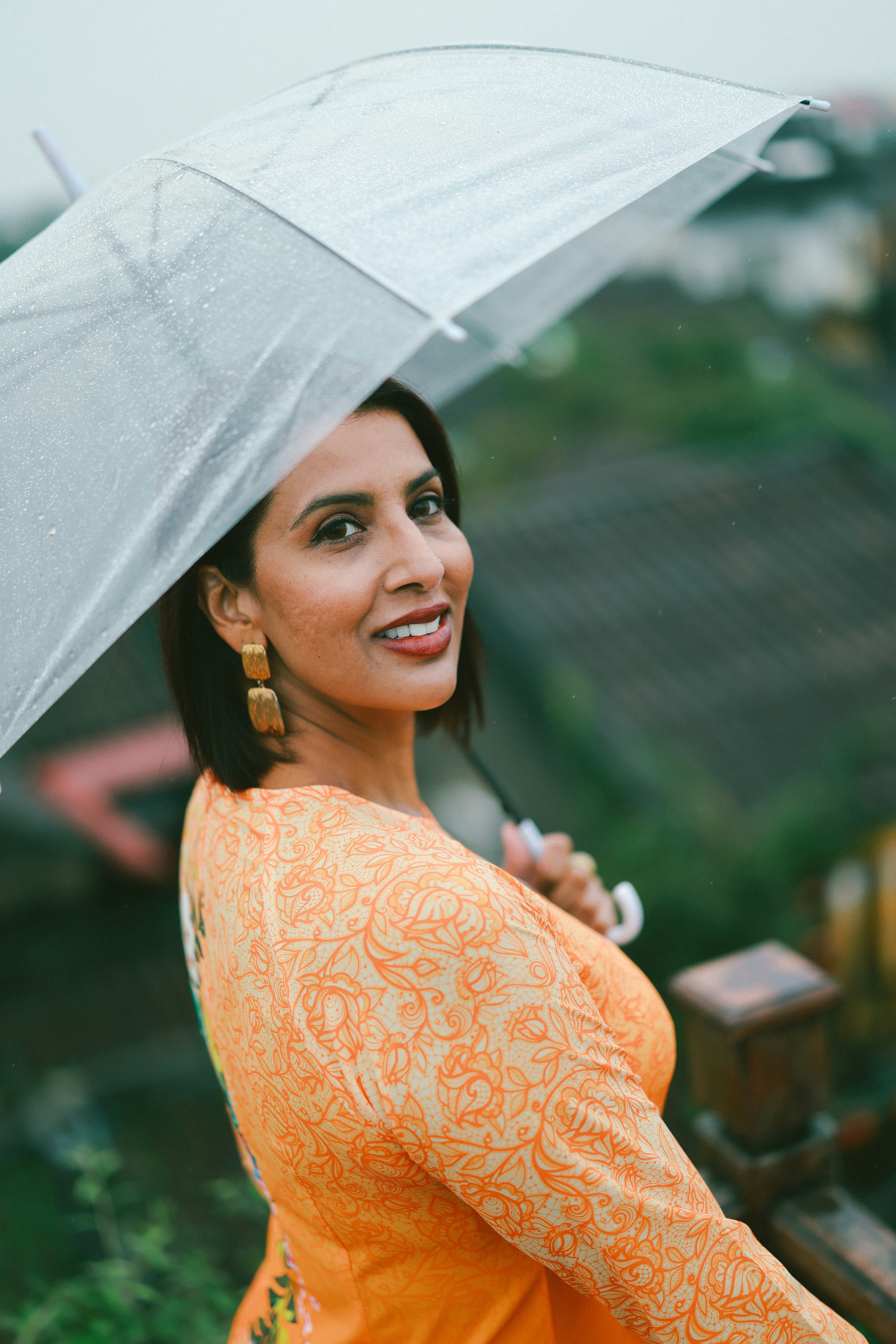 Portrait in the Rain: Orange Lace under a Silver Umbrella