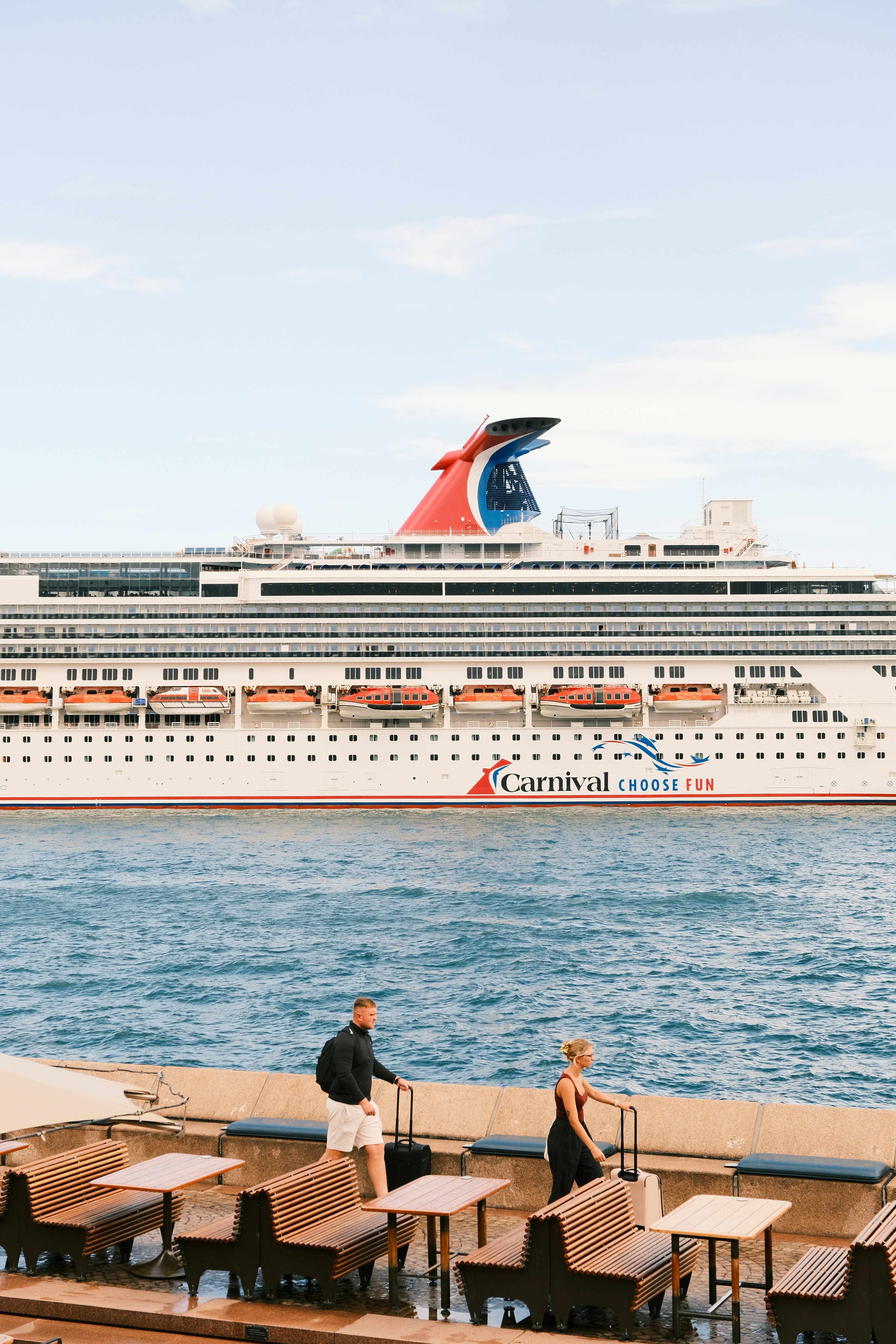 Between Benches and Behemoth: A Carnival Cruise Glides Past