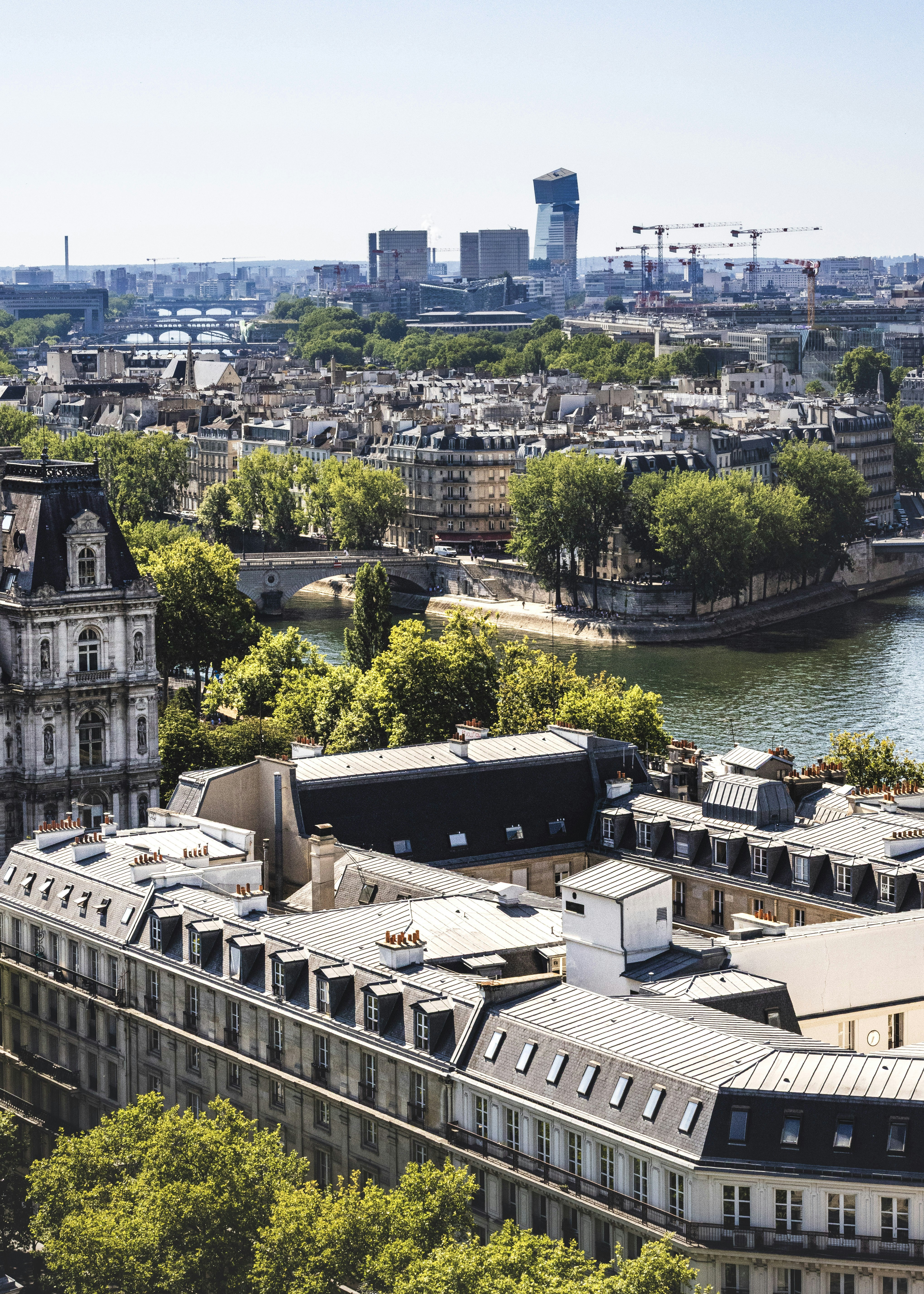 Glass Tower Above the Seine: Parisian Rooftops Meet the Modern Skyline
