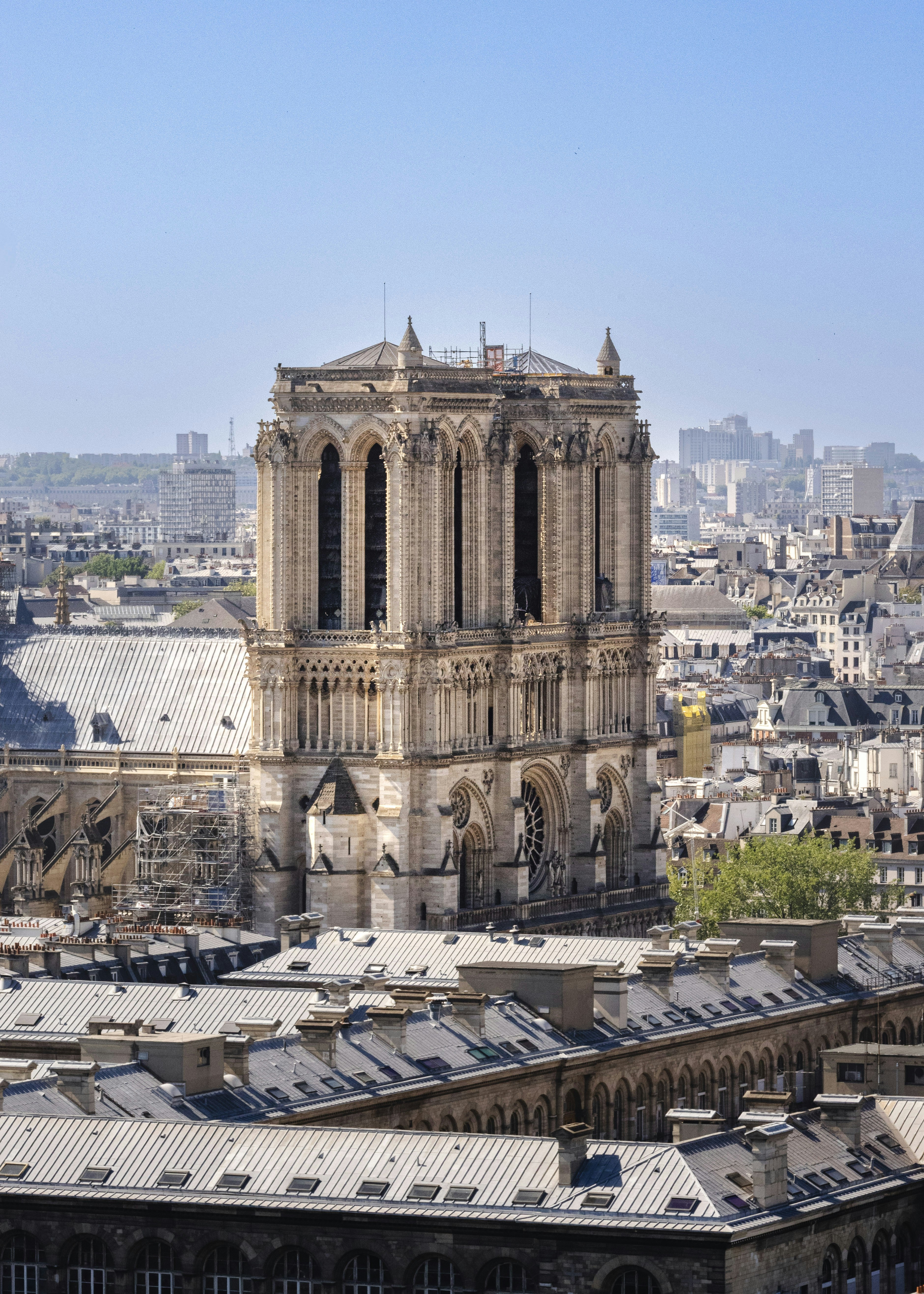 Tower Over Paris: A Gothic Bell-Tower Rising Above Rooftop Slopes