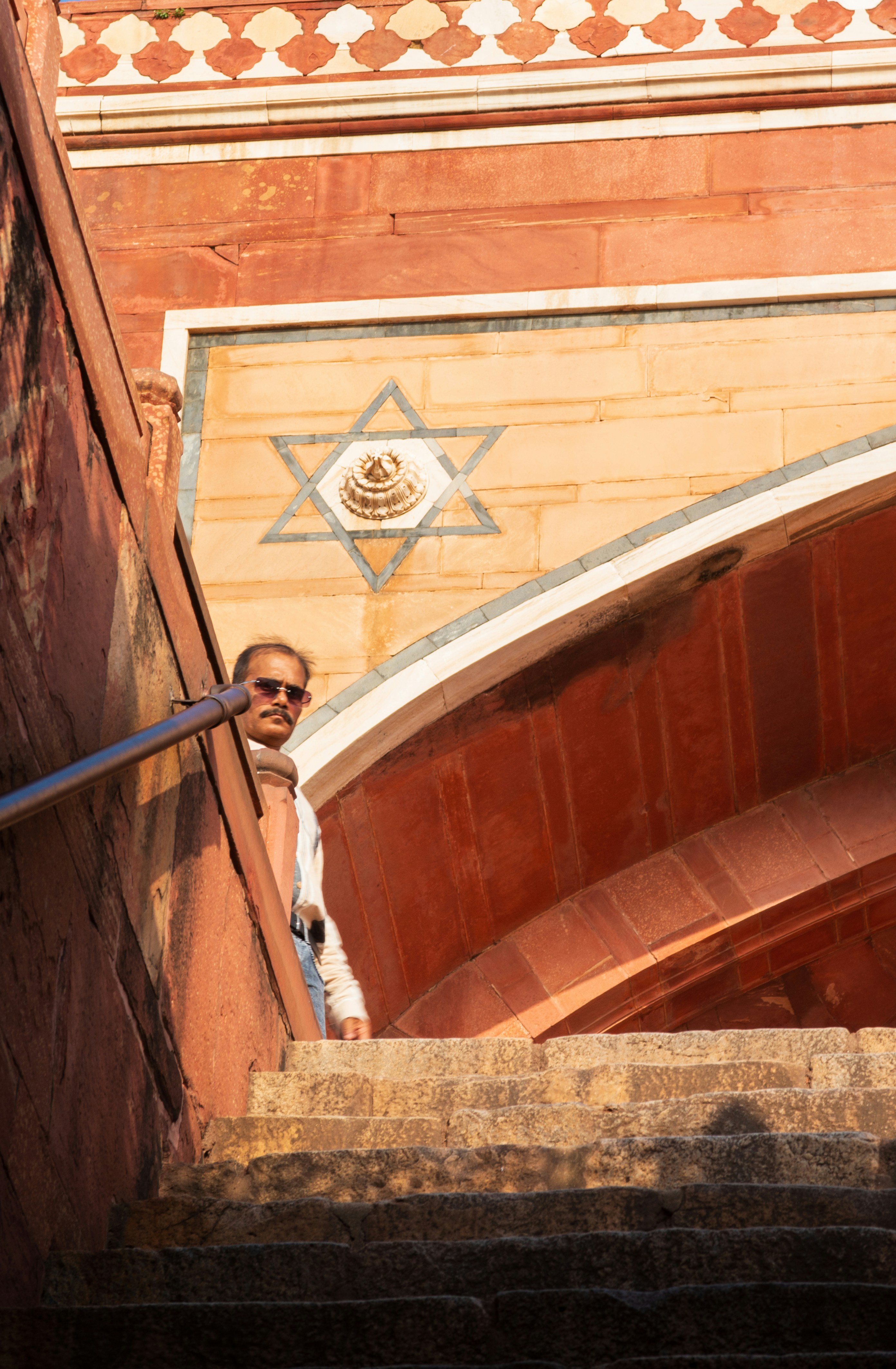 Stairway Gazer by the Arch: The Emblem Behind the Moment