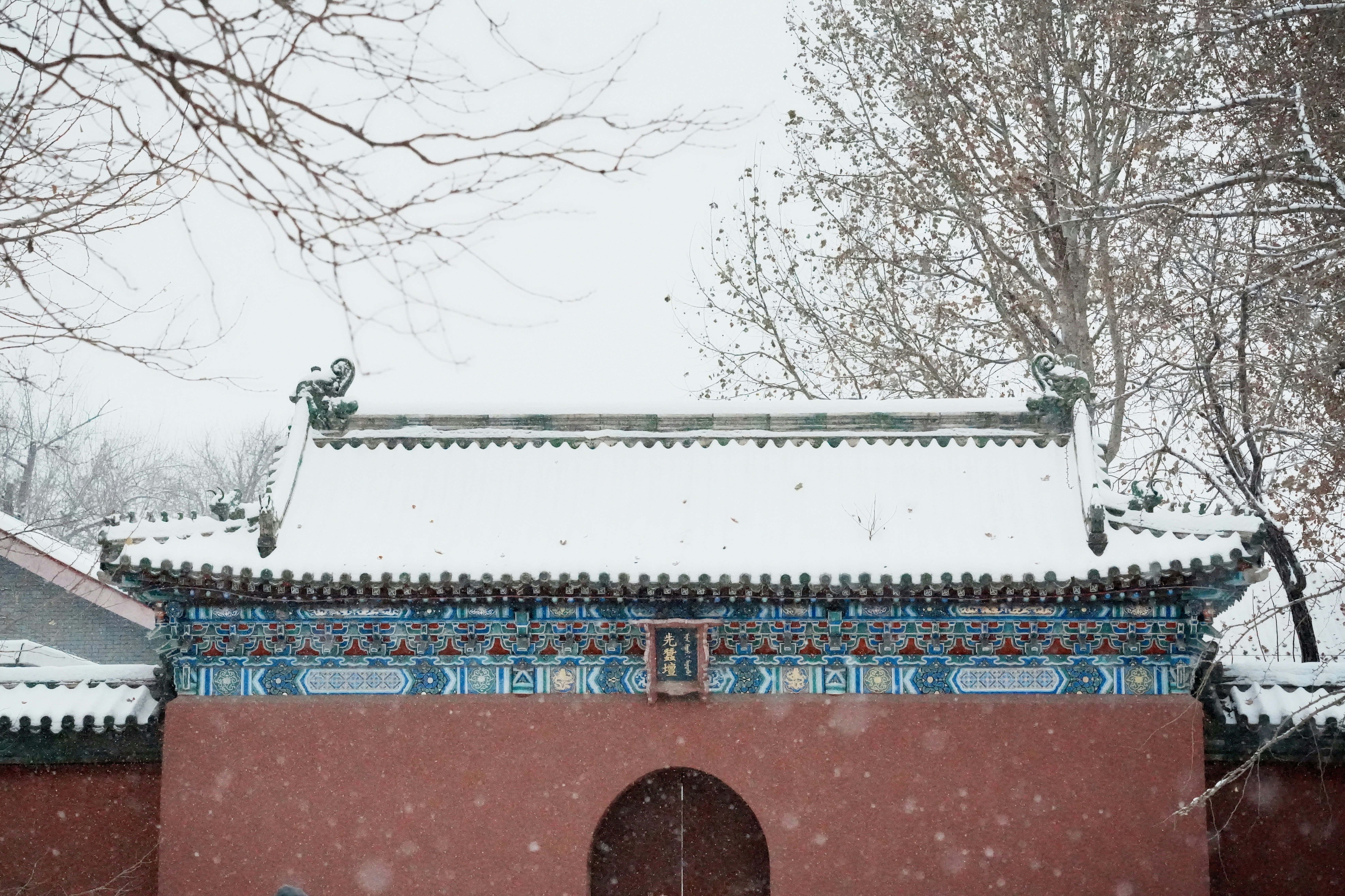 Snowbound Gatehouse: Framed in Winter Whispers